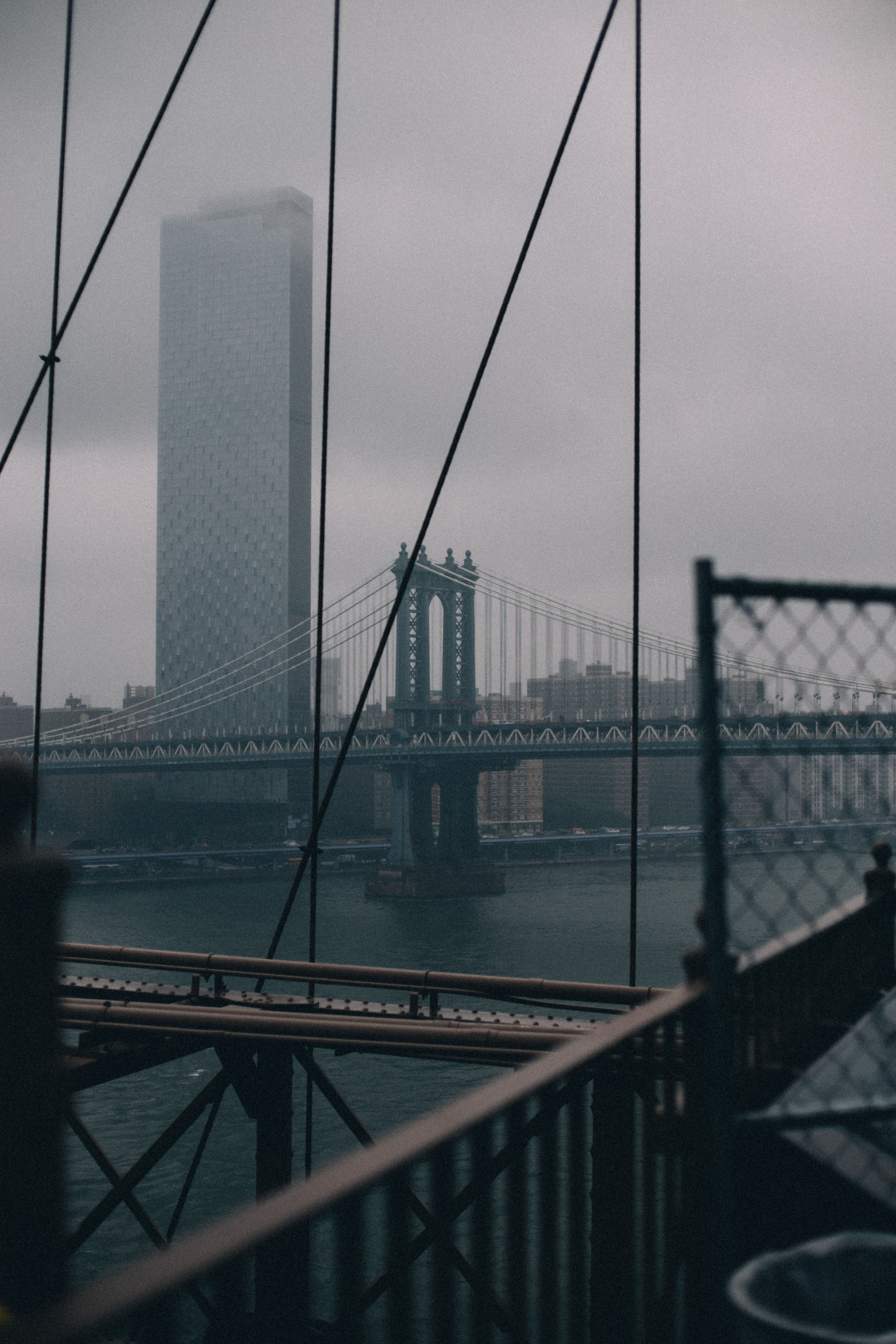 Manhattan Bridge and One Manhattan Square Skyscraper on a Rainy Day ...
