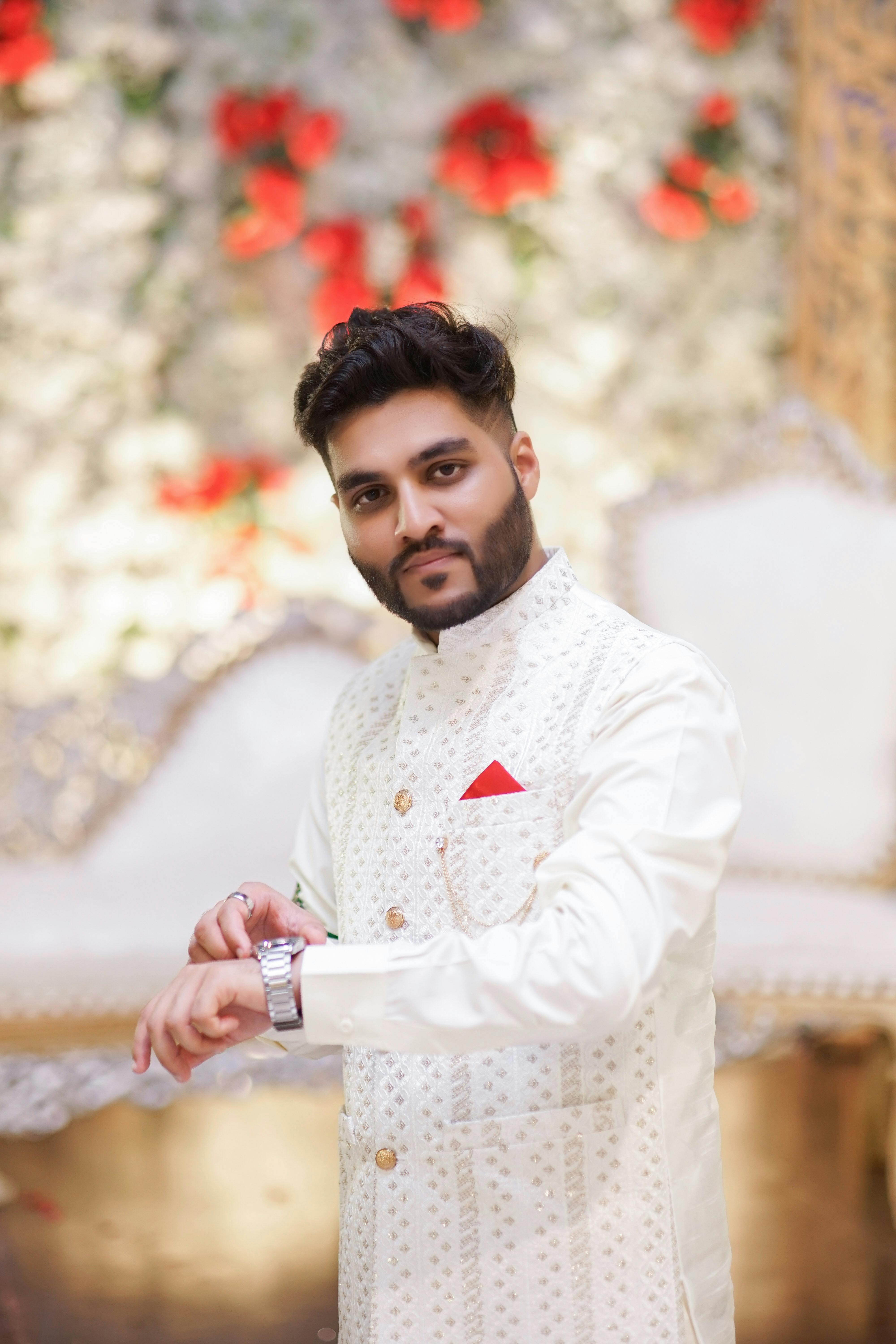 Grrom Standing in Traditional Clothing · Free Stock Photo