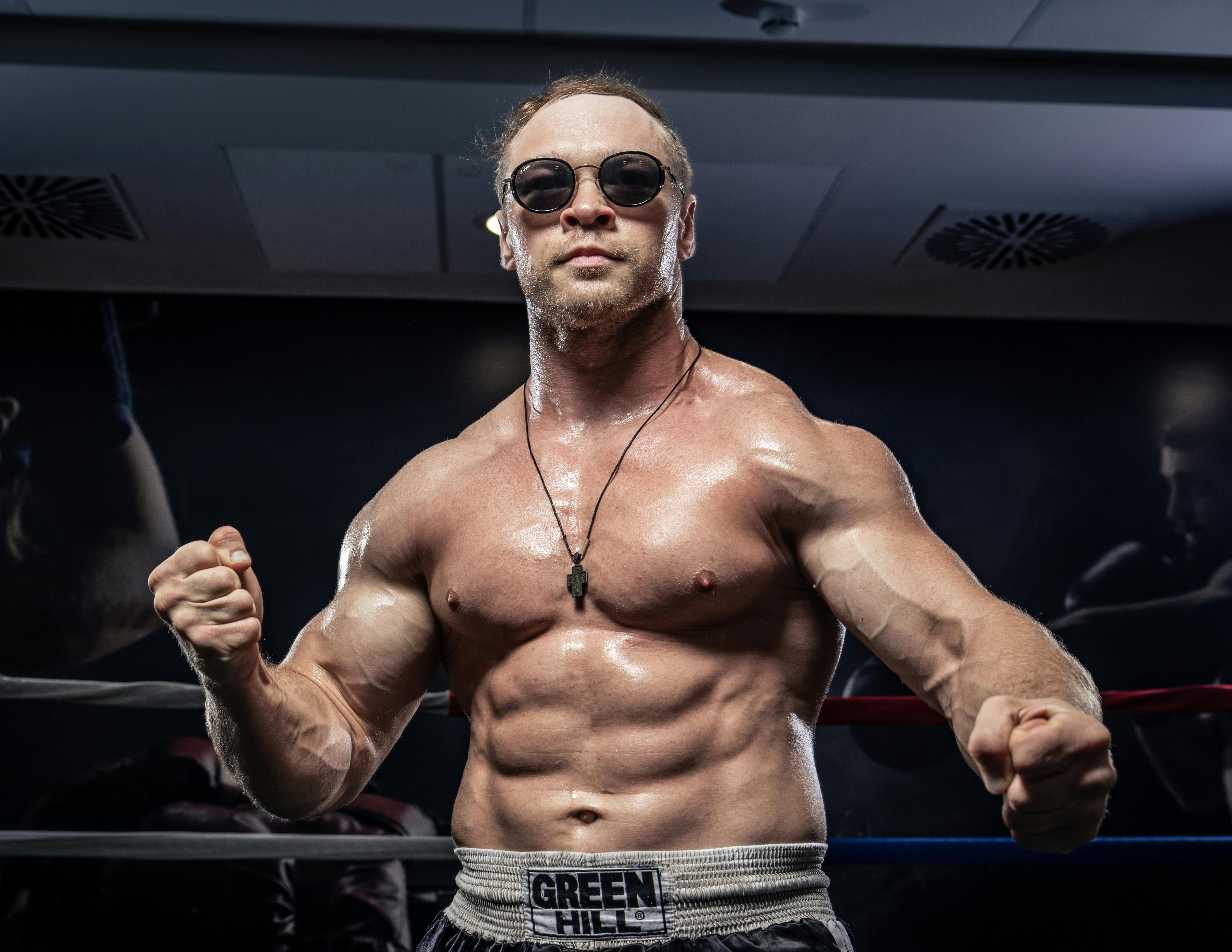 Muscular Boxer Posing in Boxing Ring · Free Stock Photo