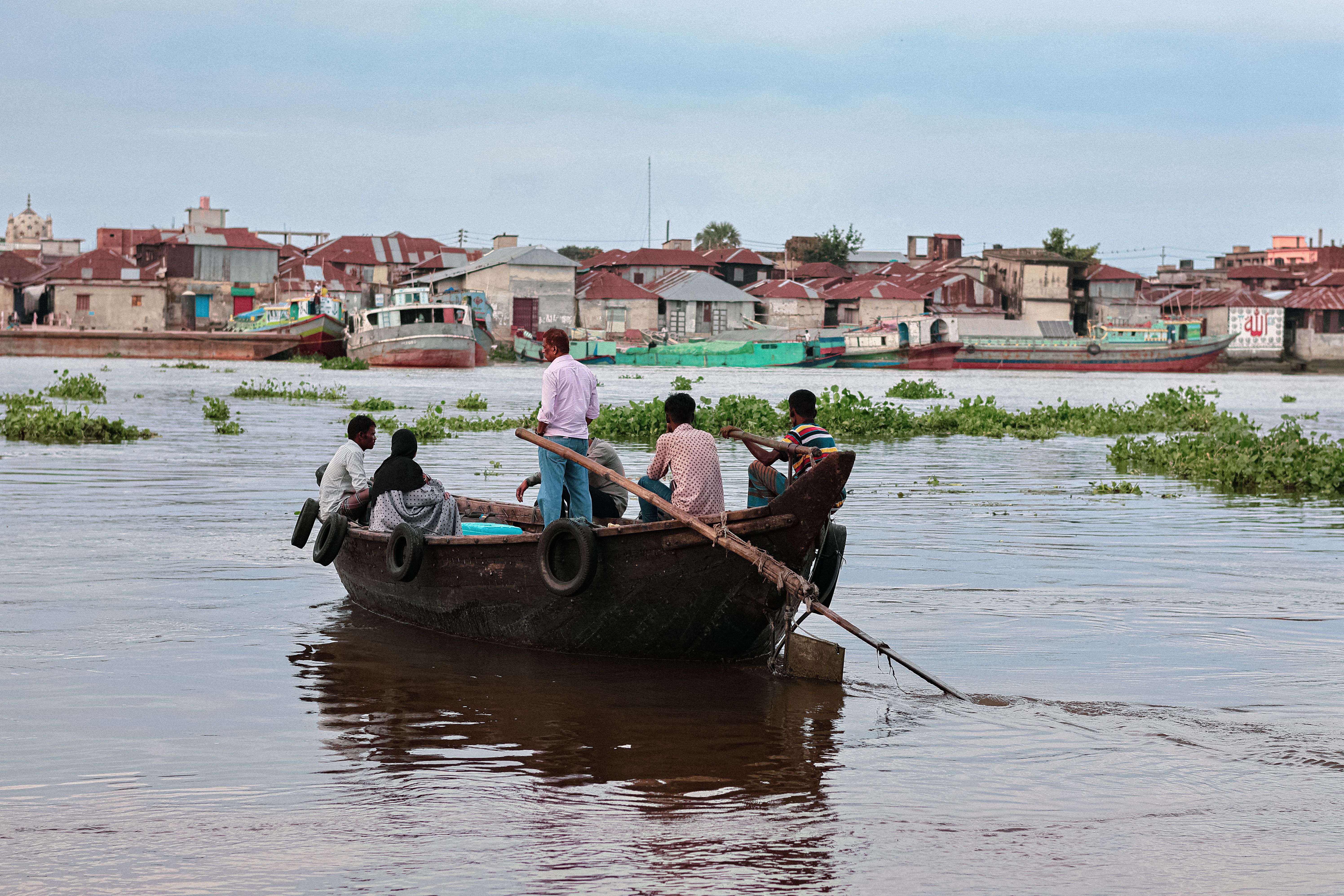 People on Fishing Boat in Village · Free Stock Photo