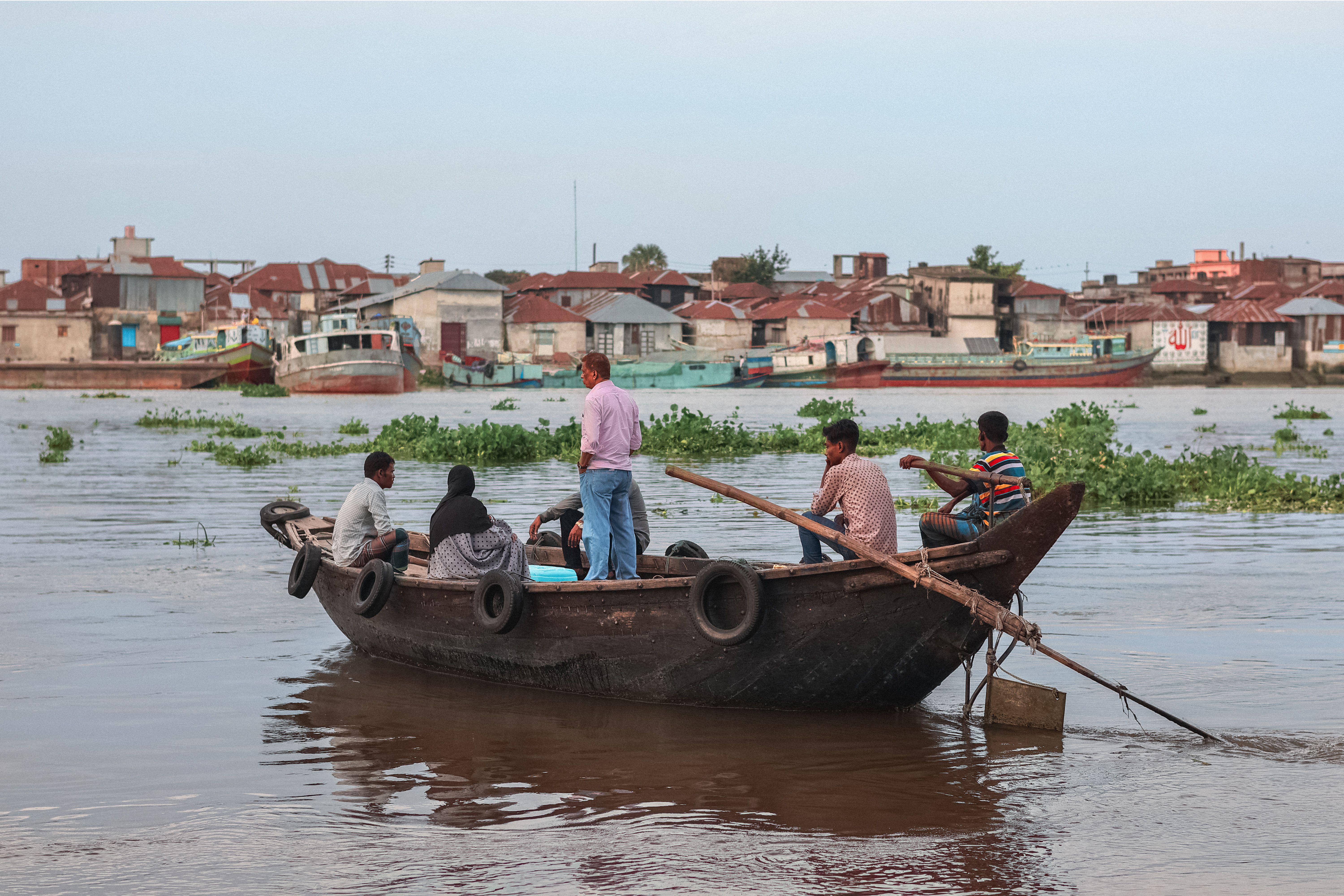 People on Fishing Boat in Village · Free Stock Photo