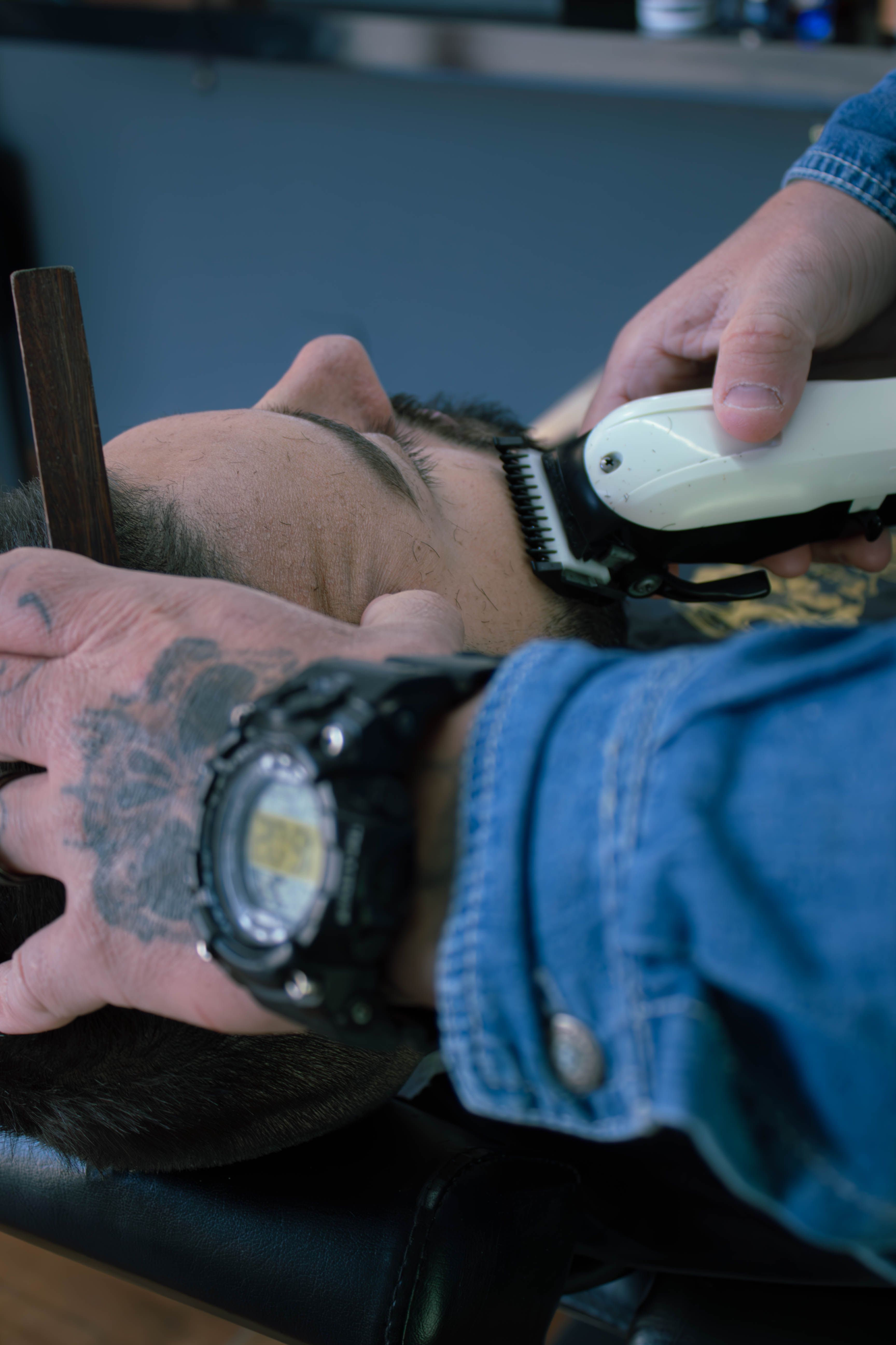 Barber Trimming Customer Beard · Free Stock Photo