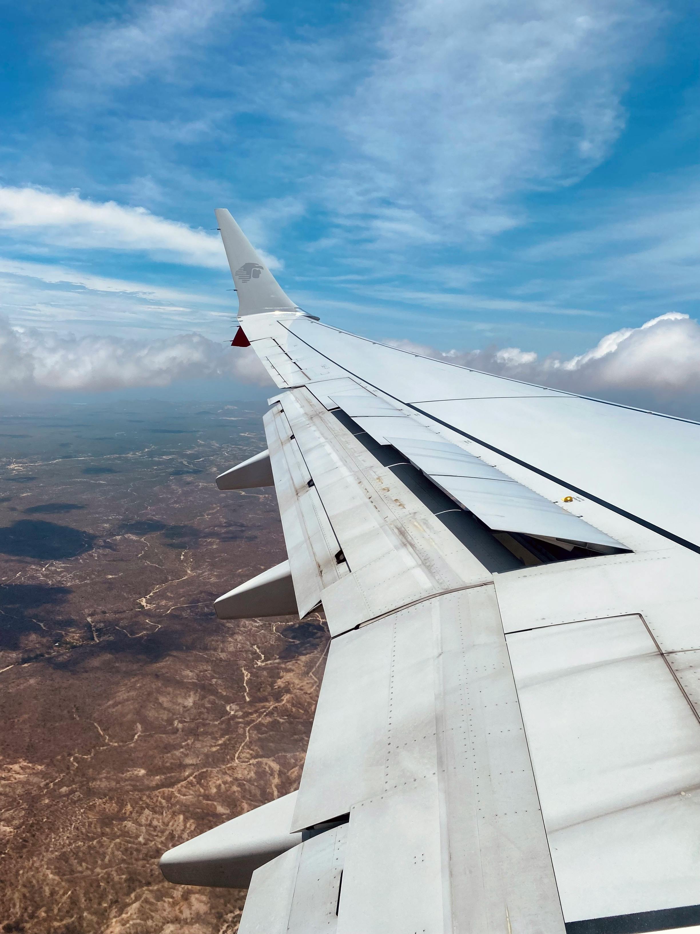 View over Airplane Wing in Flight · Free Stock Photo