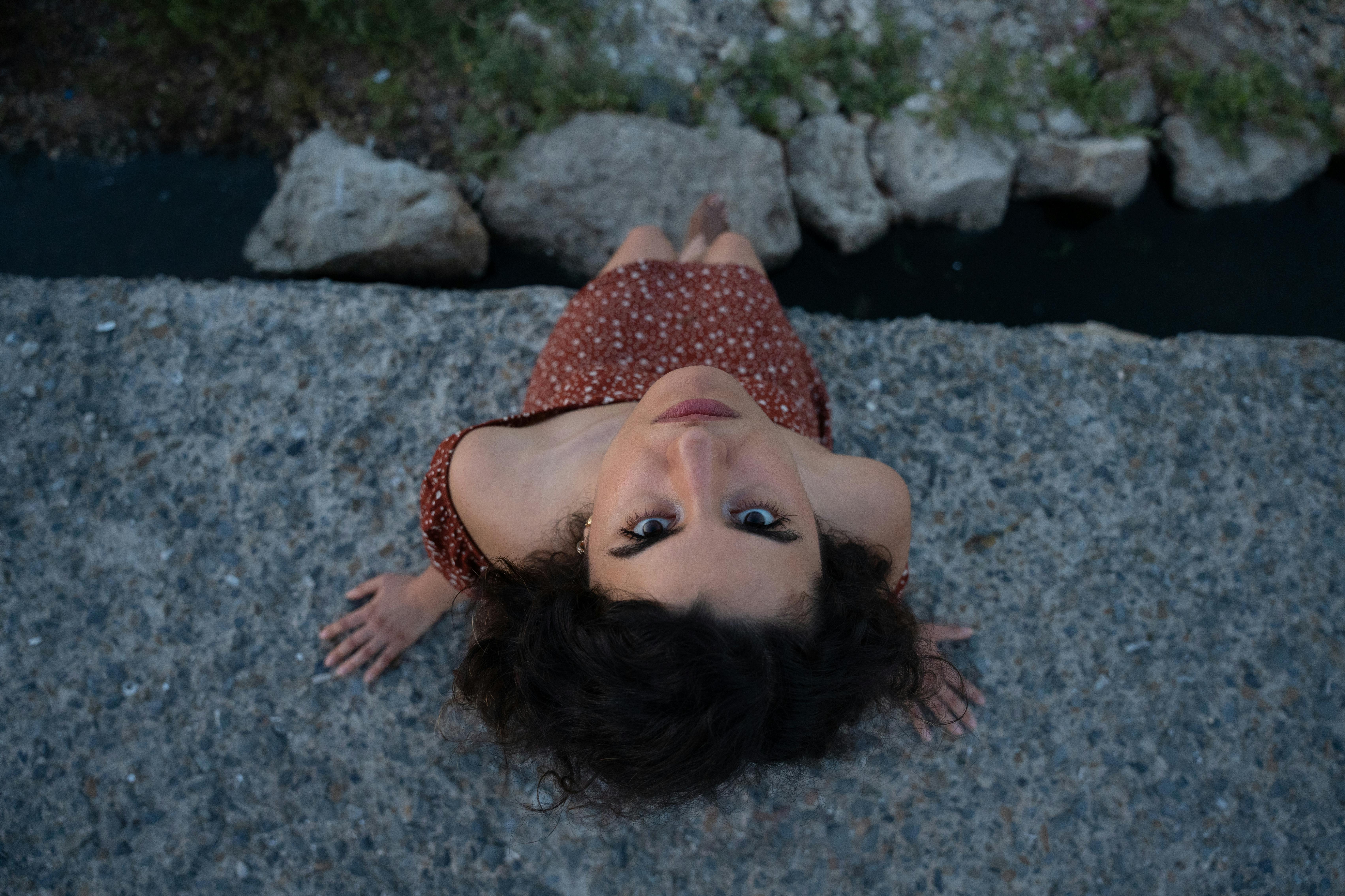 Woman Sitting On Rock Staring Straight Ahead Photos, Download The BEST ...