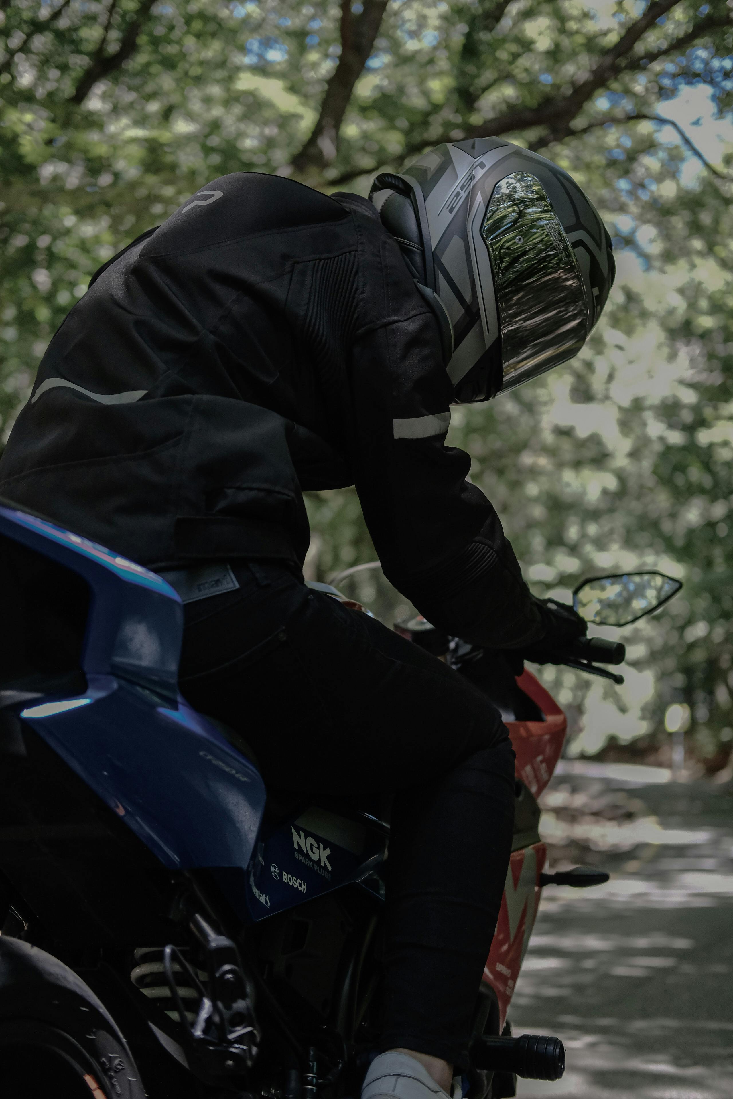 A person in a helmet riding a motorcycle · Free Stock Photo
