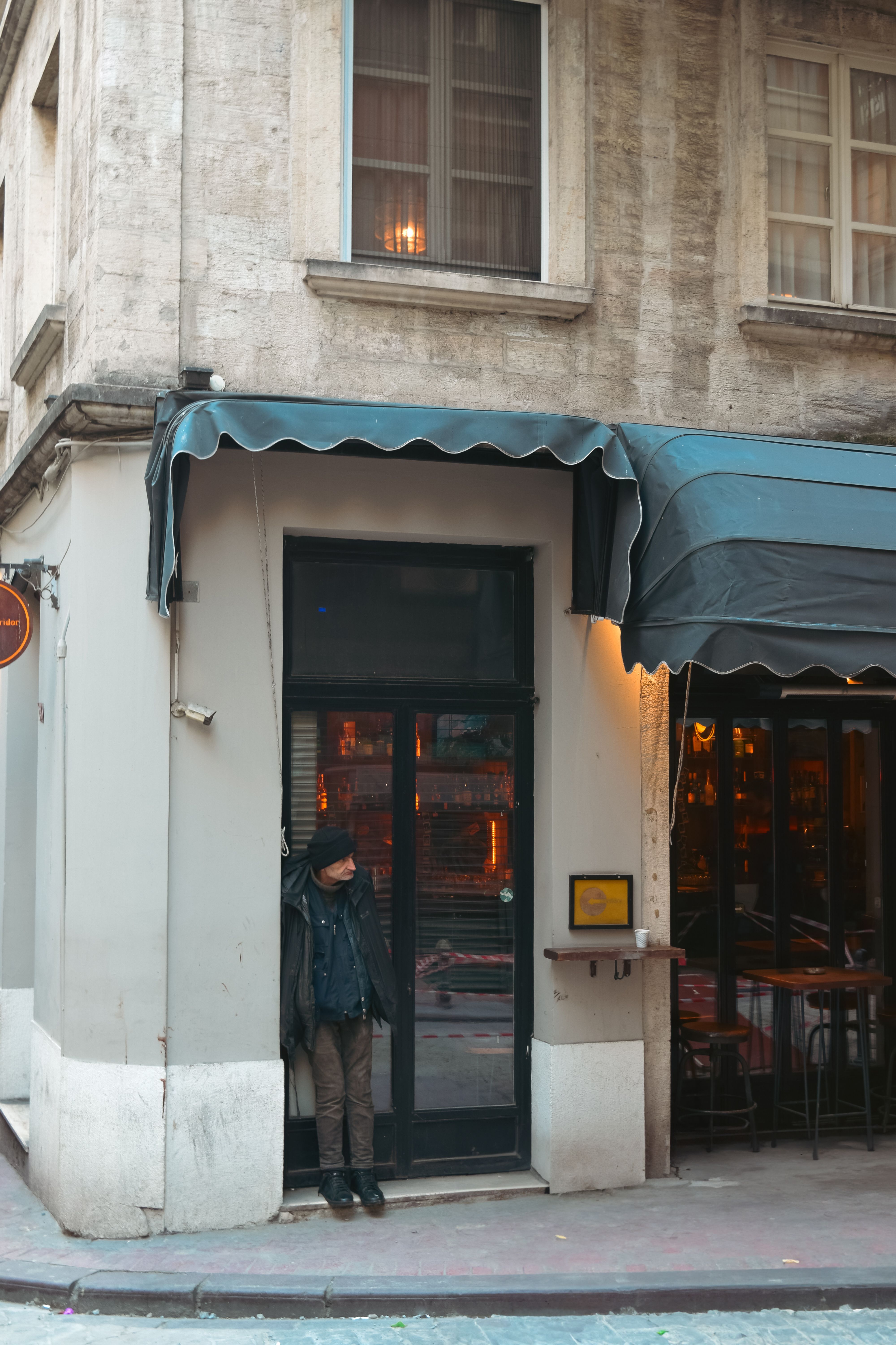 Red Window Shutters of Cafe by Steep Cobblestone Street · Free Stock Photo