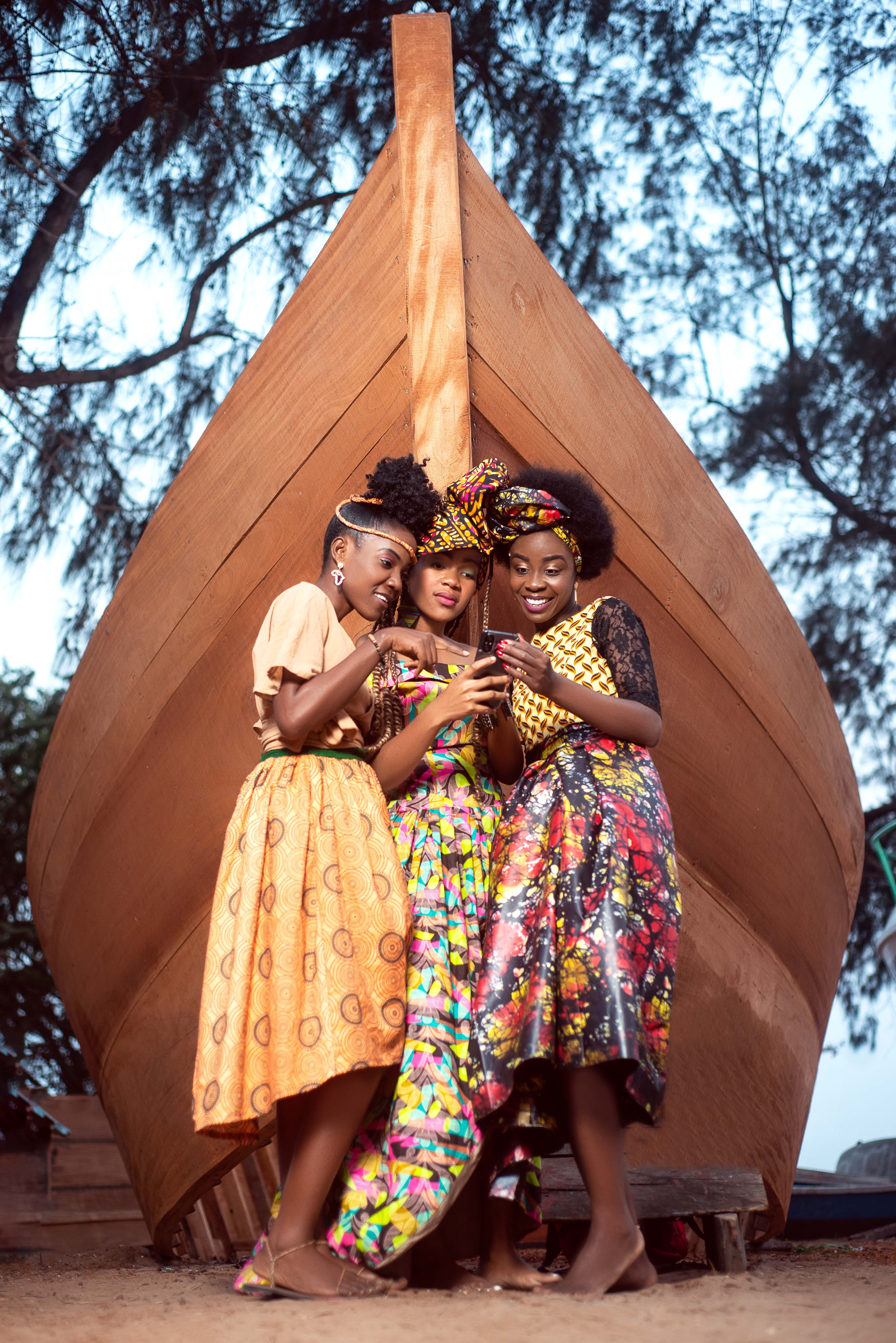 Smiling Women in Colorful Dresses · Free Stock Photo