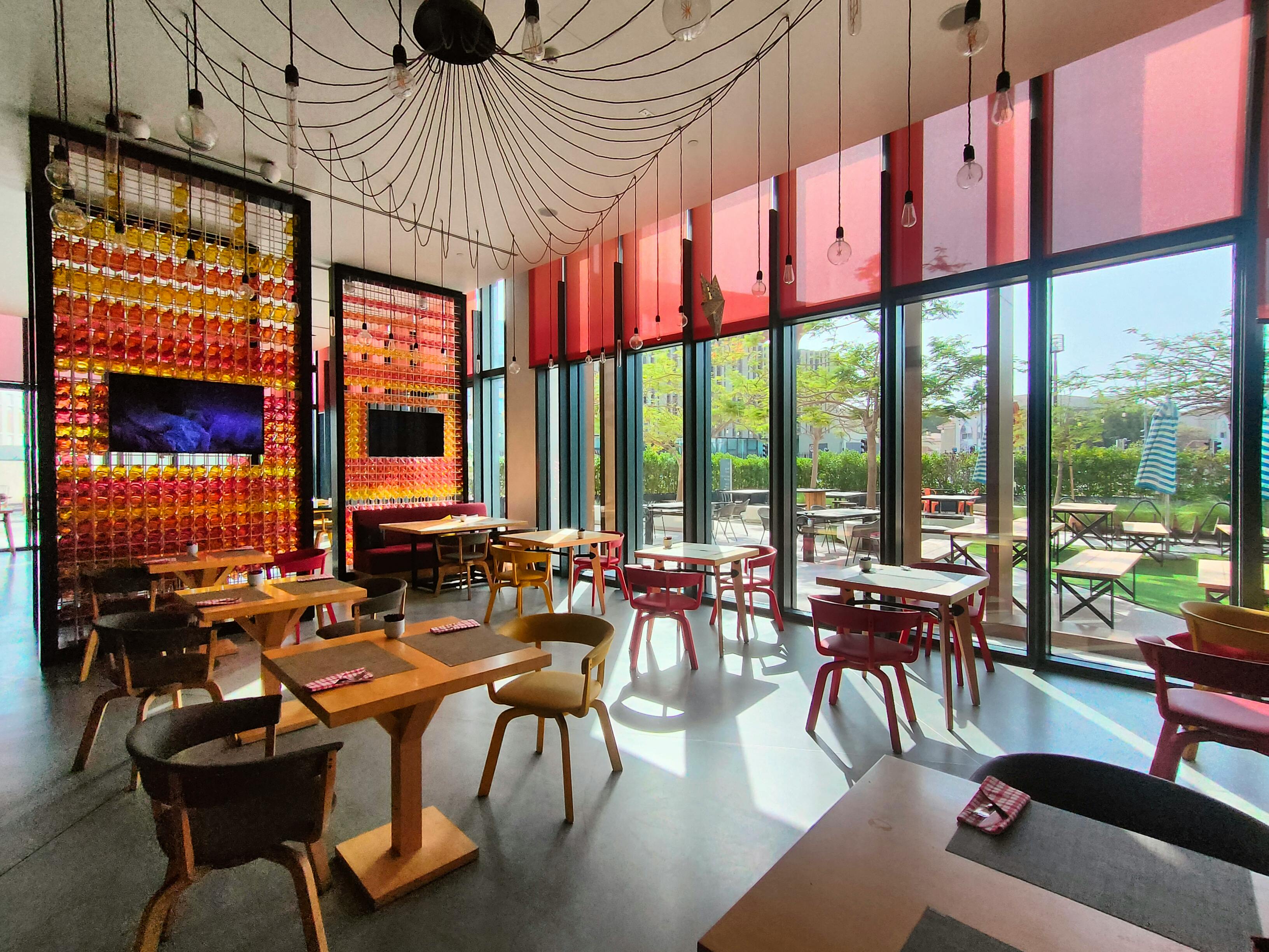 Sunny Cafe Interior Decorated with Stained Glass · Free Stock Photo