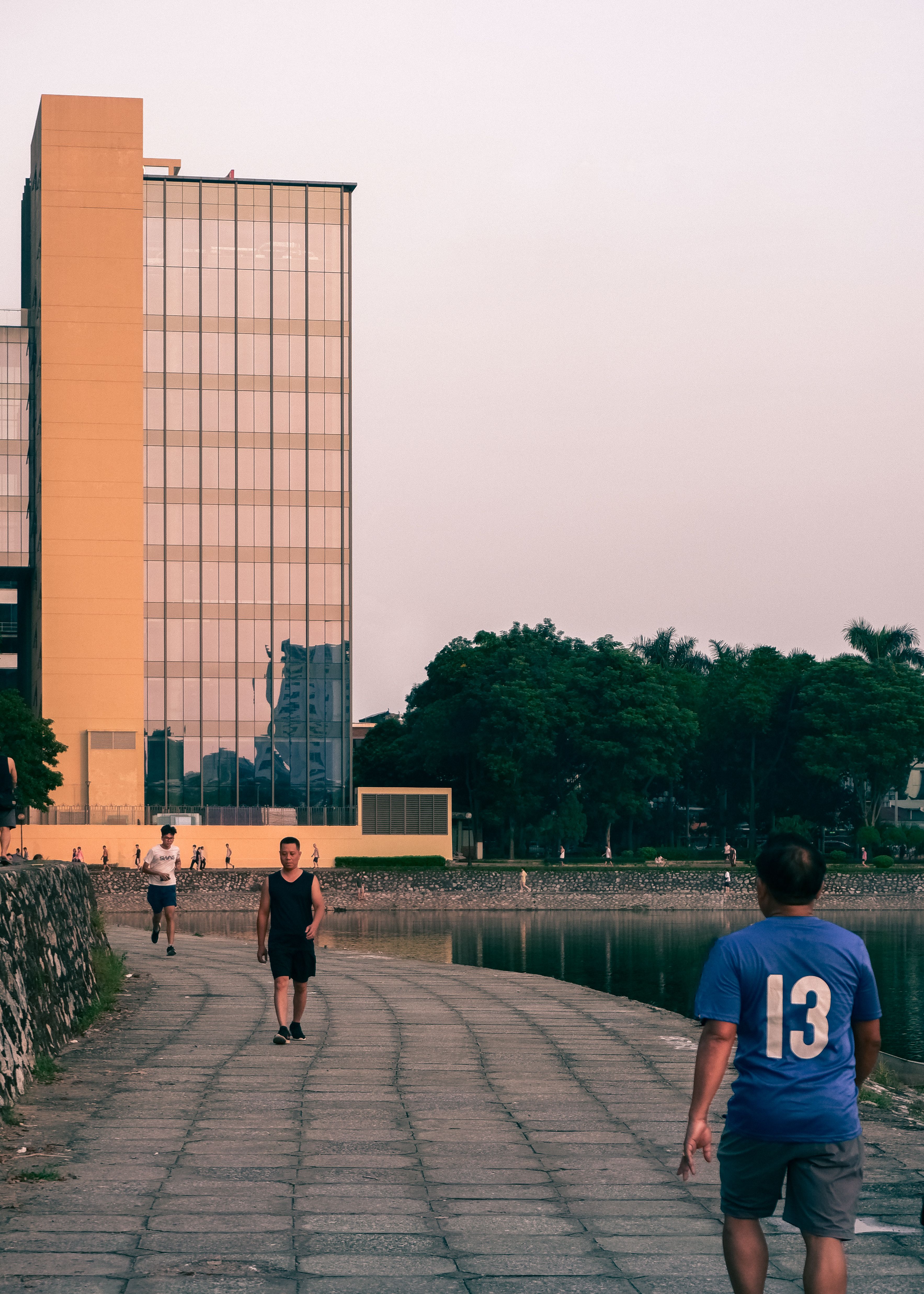 Men Walking and Running on Pavement · Free Stock Photo