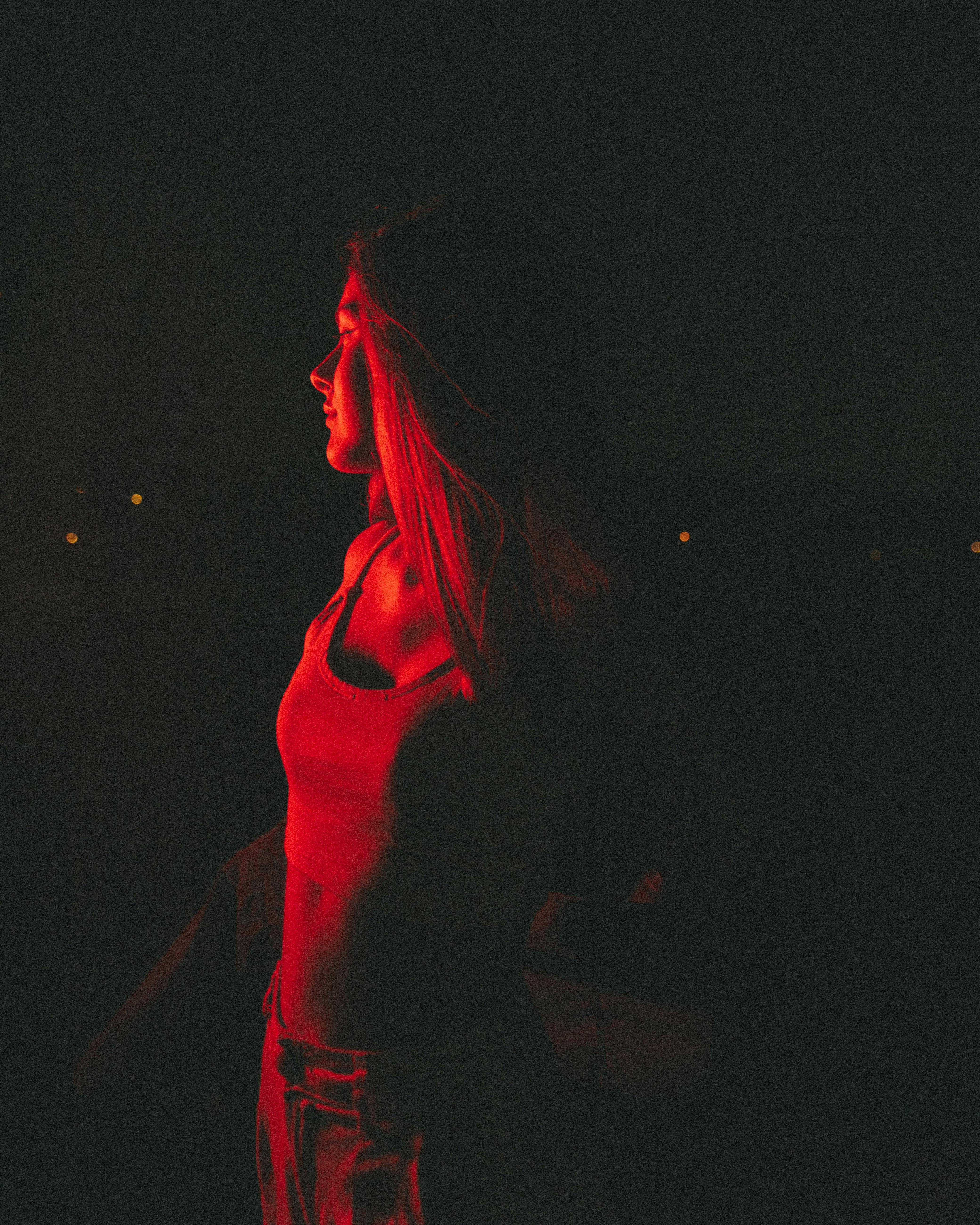 Woman in Red Light at Night · Free Stock Photo