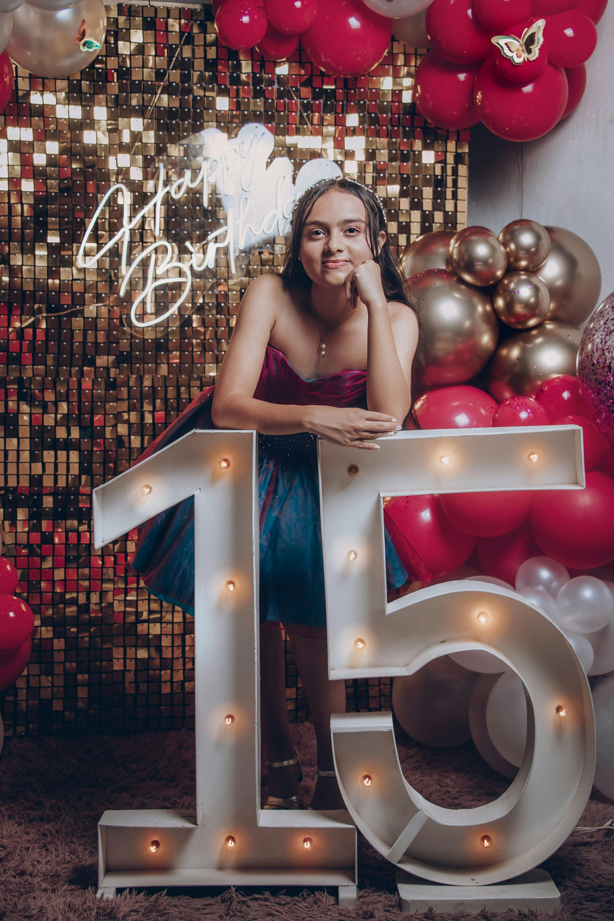 A Girl Standing among the Decorations for Her 15th Birthday Party ...