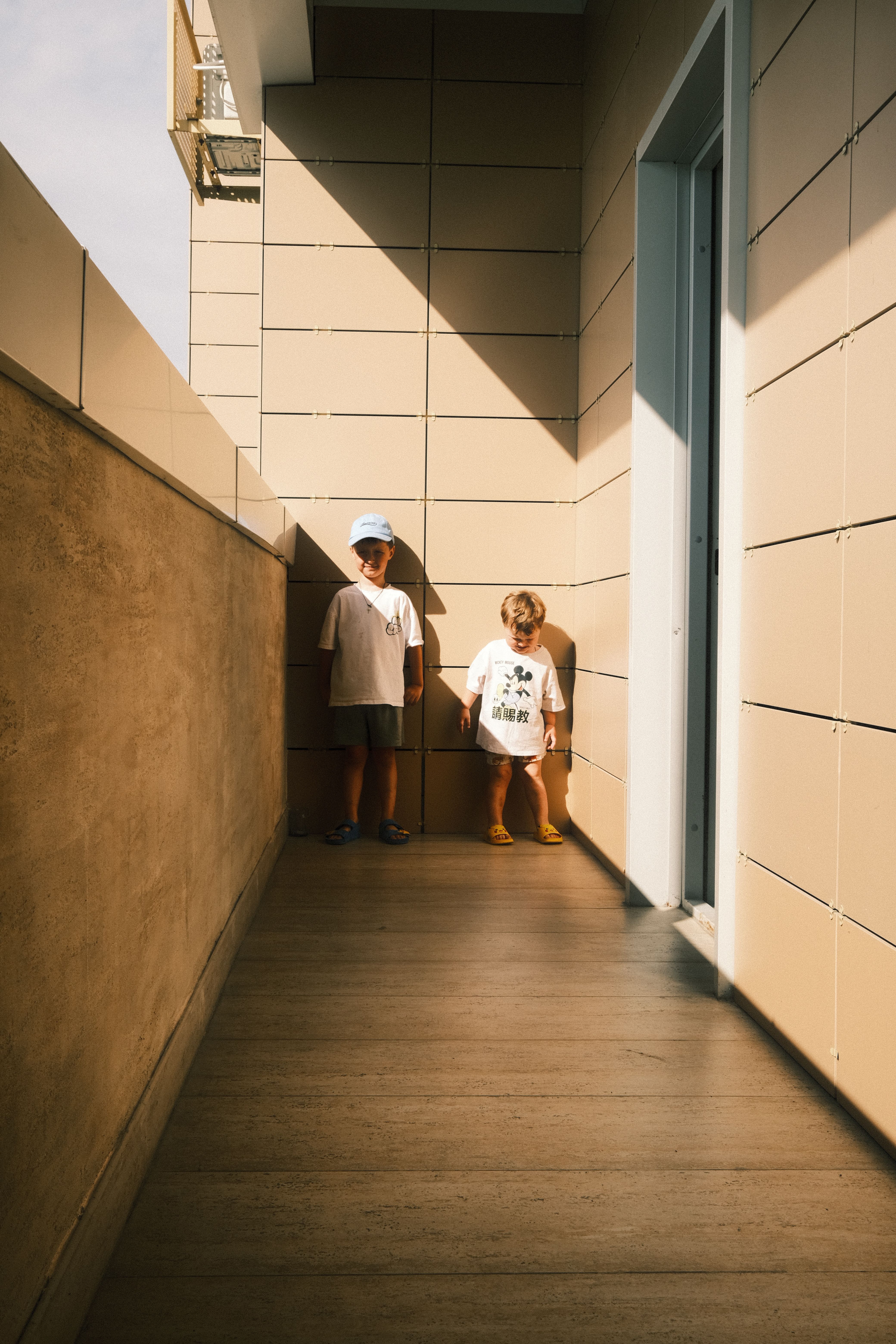 Boys Standing on Balcony · Free Stock Photo