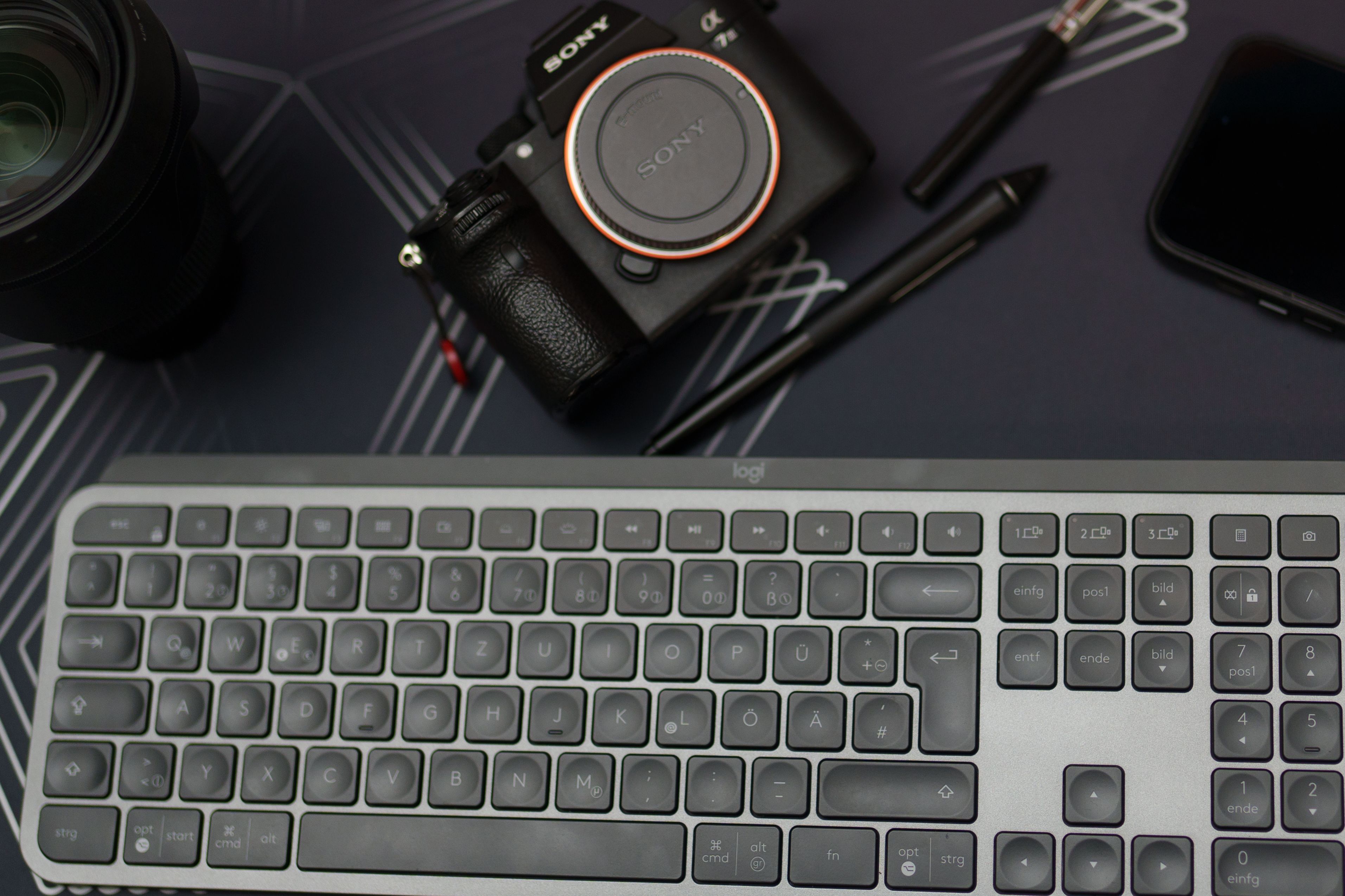 Sony Digital Photo Camera and Computer Keyboard Lying on a Table · Free ...