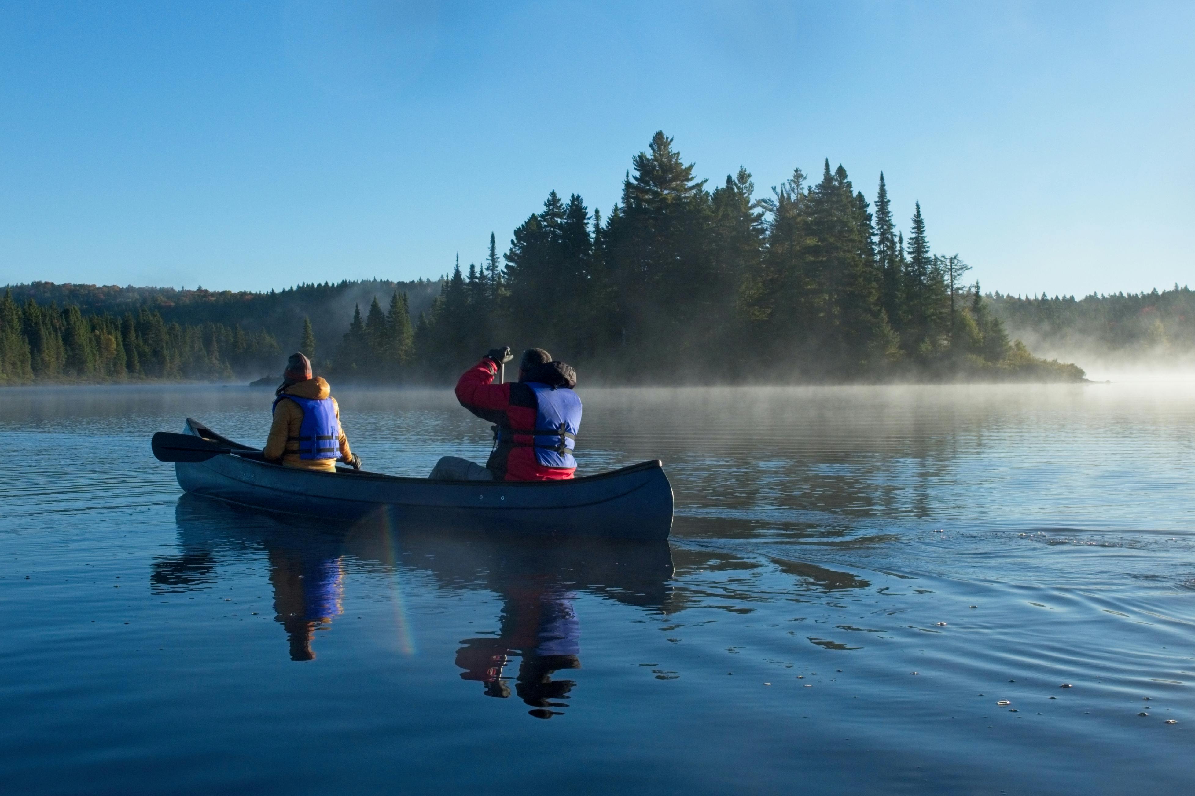 Person Boating in a Canoe on the Lake · Free Stock Photo