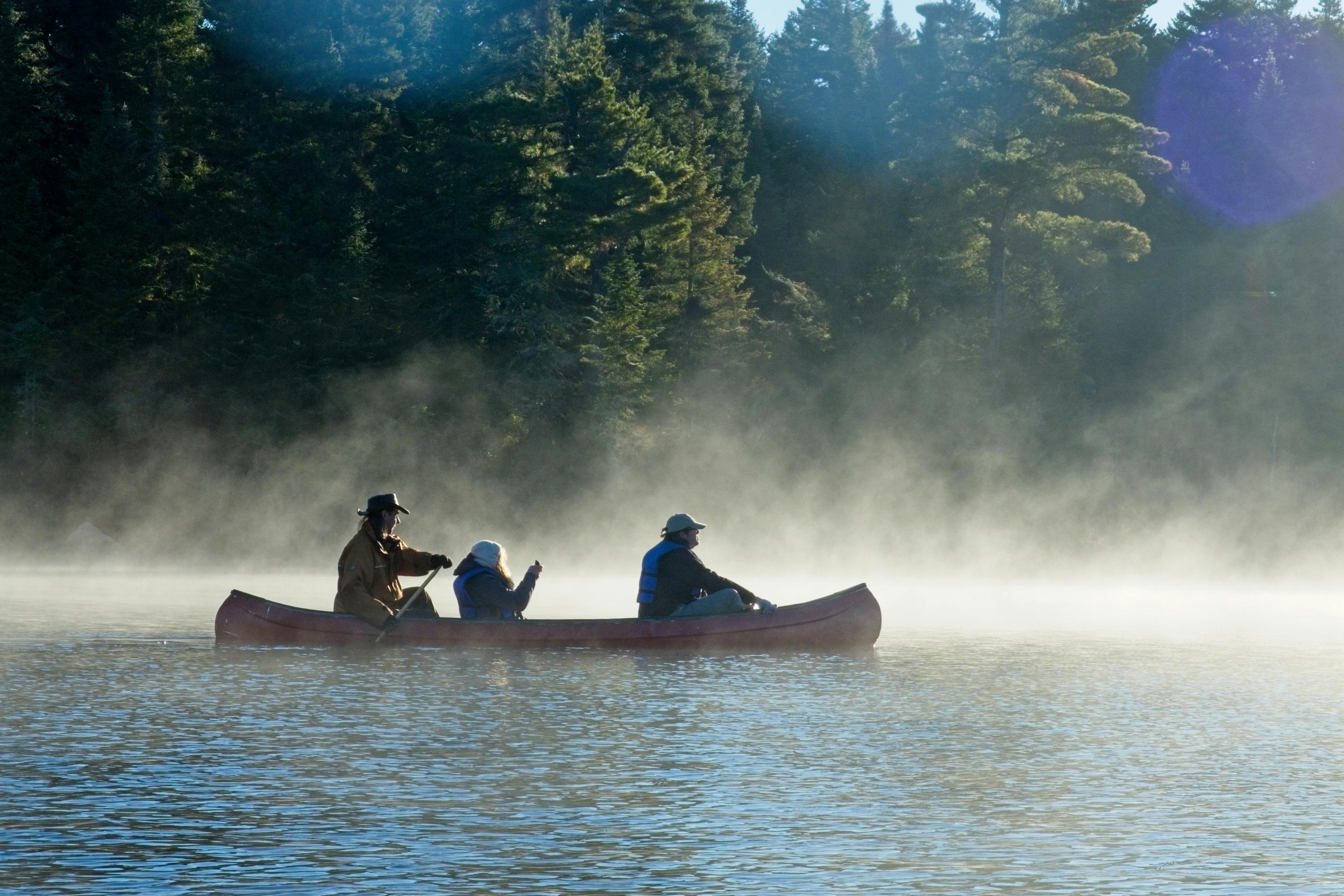 People in Canoe on River · Free Stock Photo