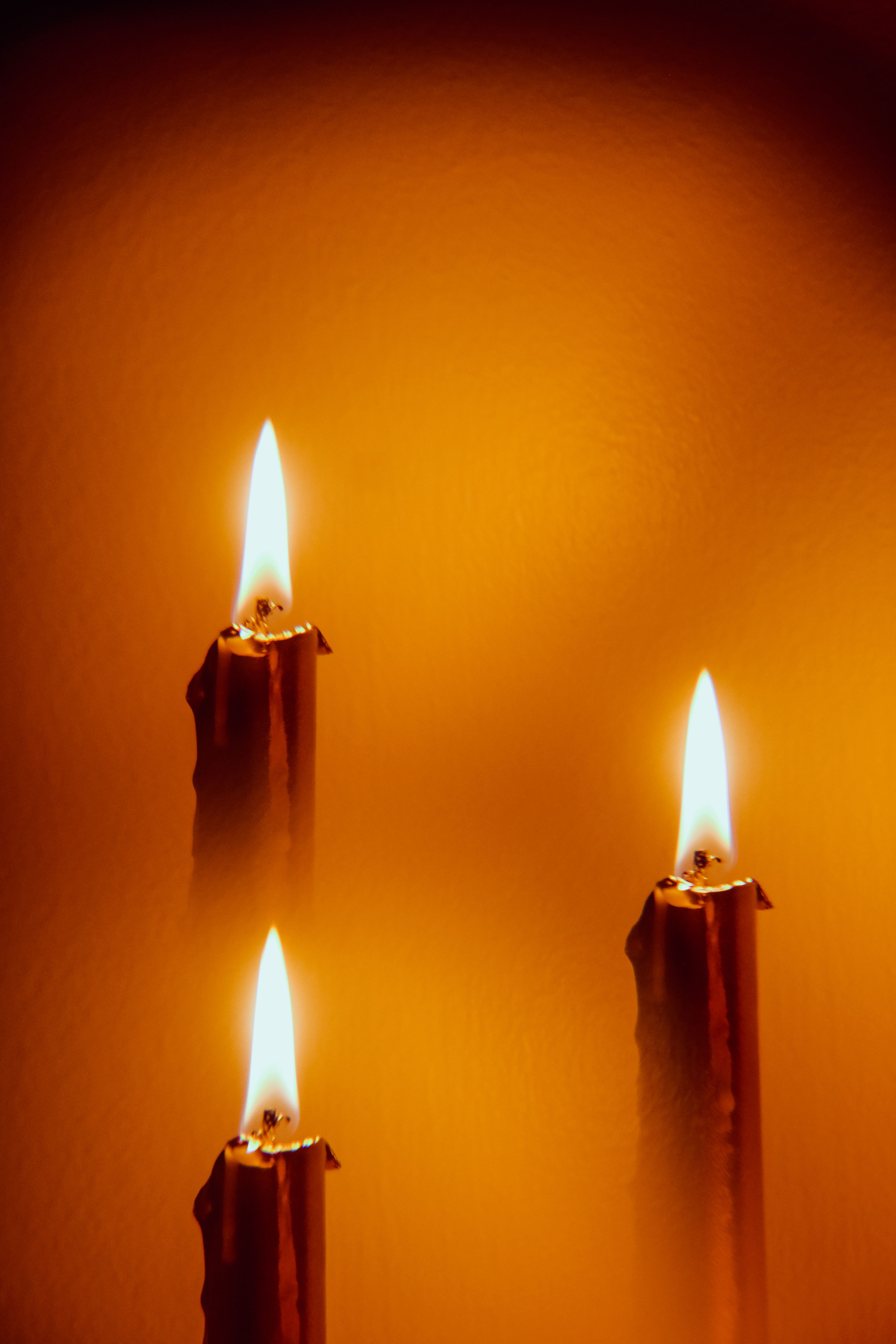 Vintage candlestick with burning candle on table at home · Free Stock Photo