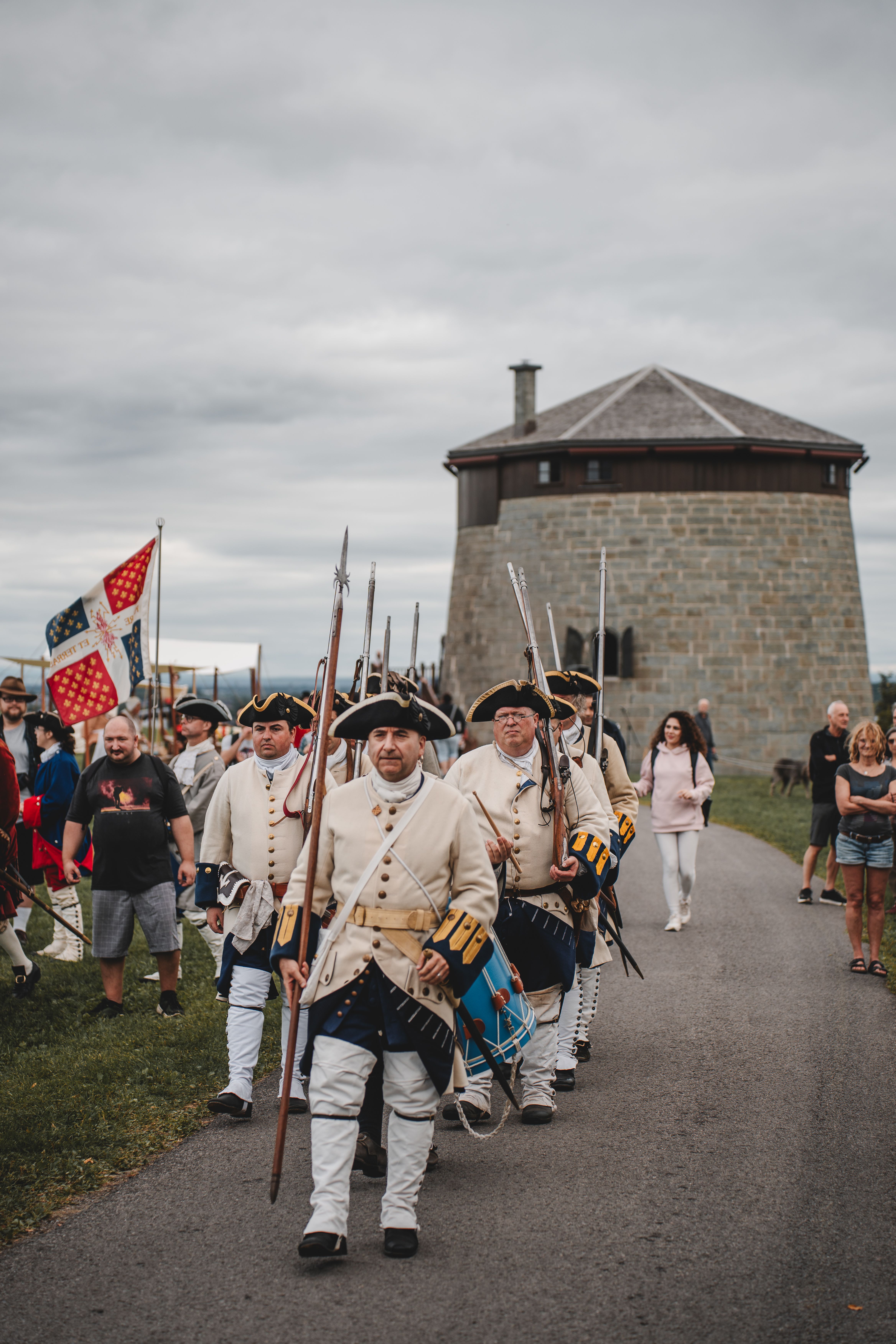 Soldiers Marching on Road at Historical Reenactment · Free Stock Photo