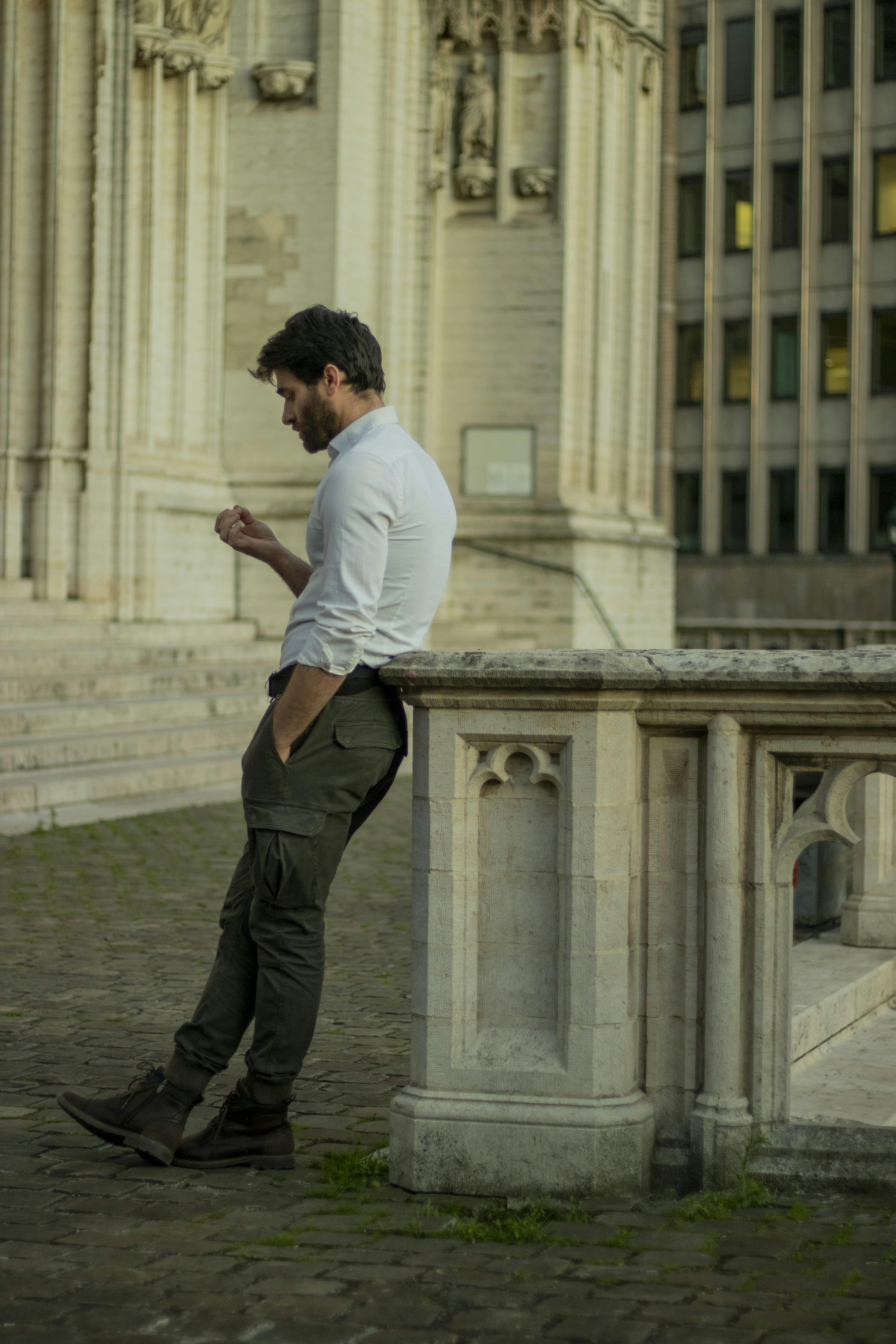Man Waiting in Front of Historic Cathedral Leaning on the Railing ...