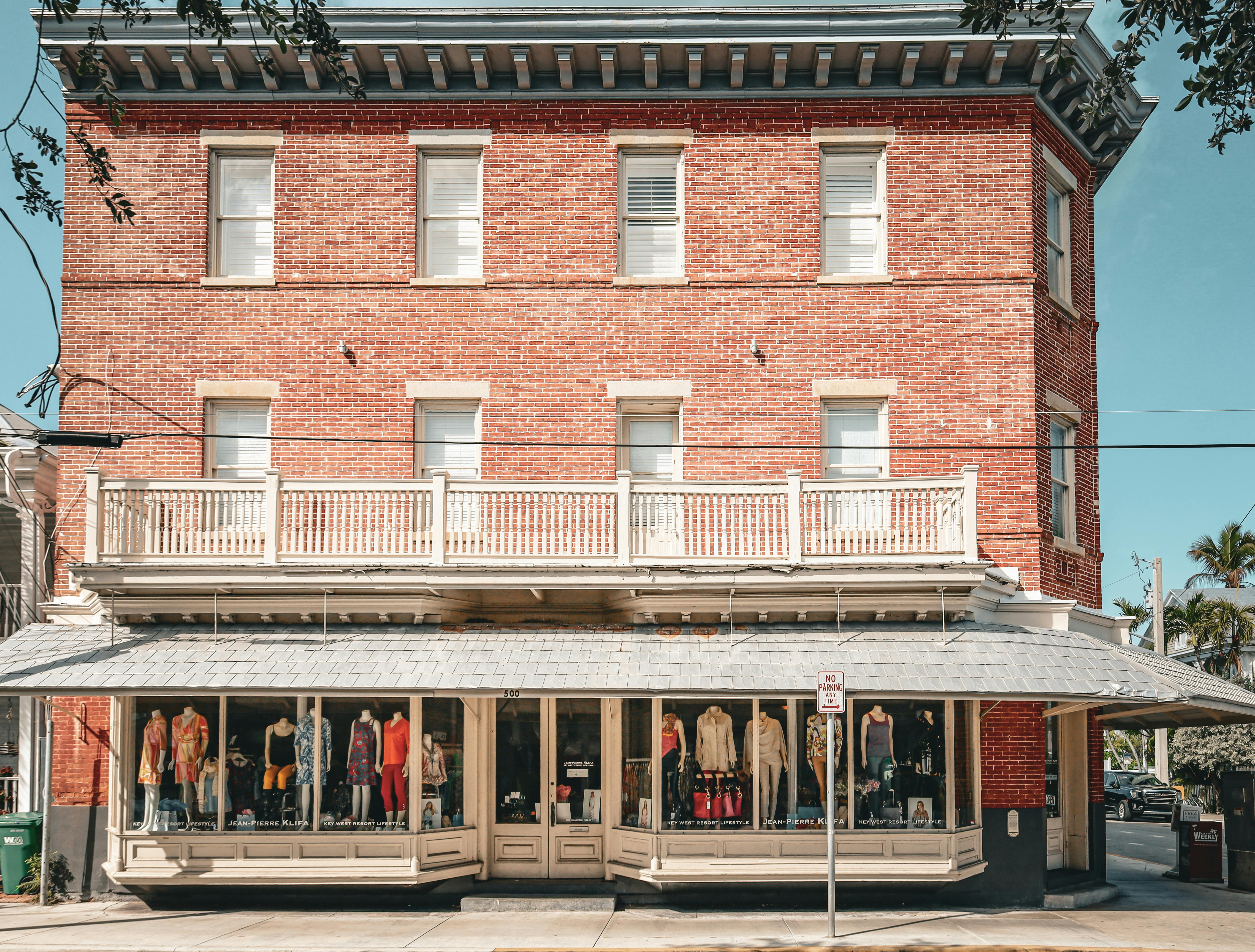 Clothing Store in Red Brick Building · Free Stock Photo