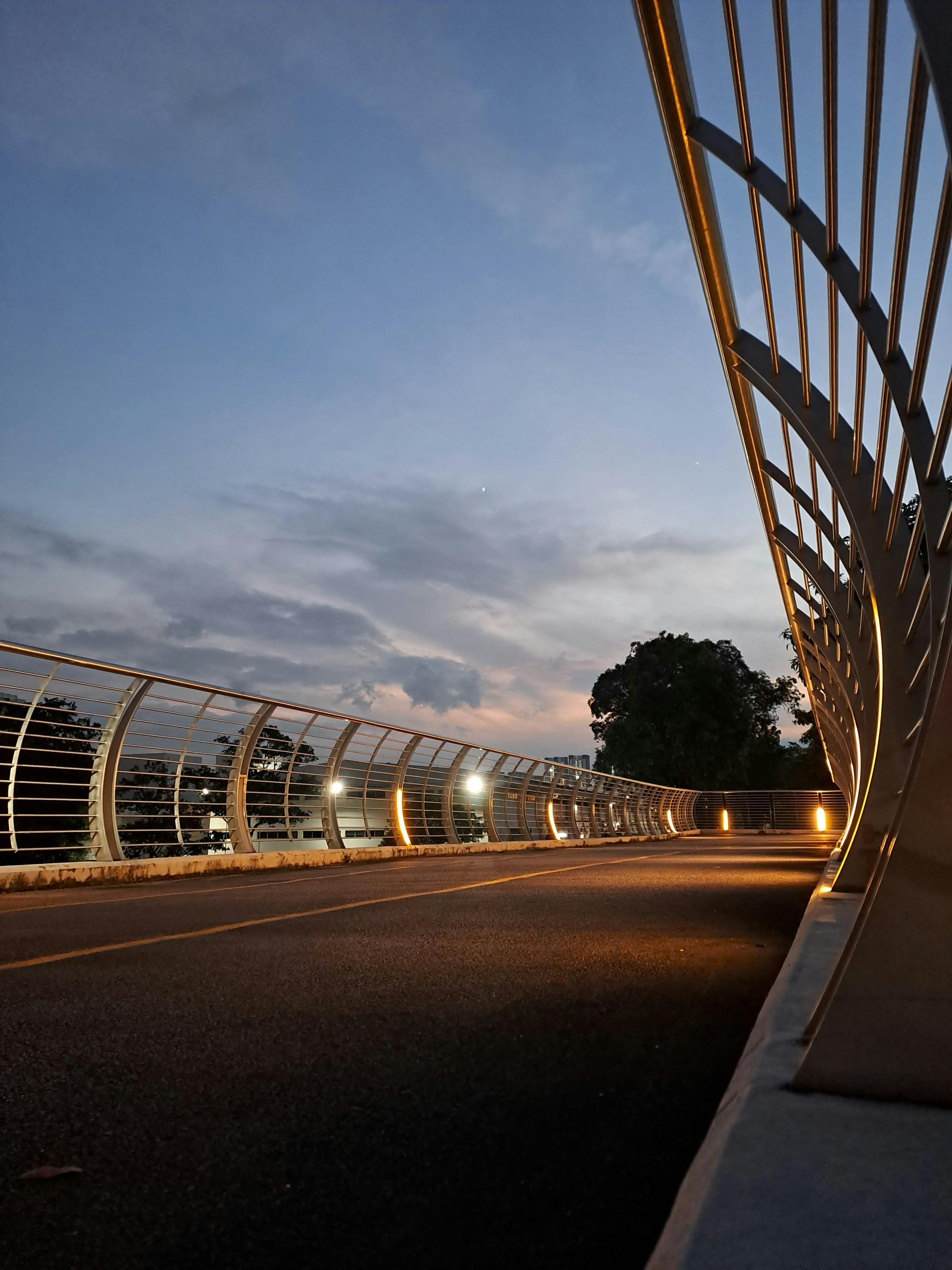 Illuminated Urban Footbridge at Dusk · Free Stock Photo