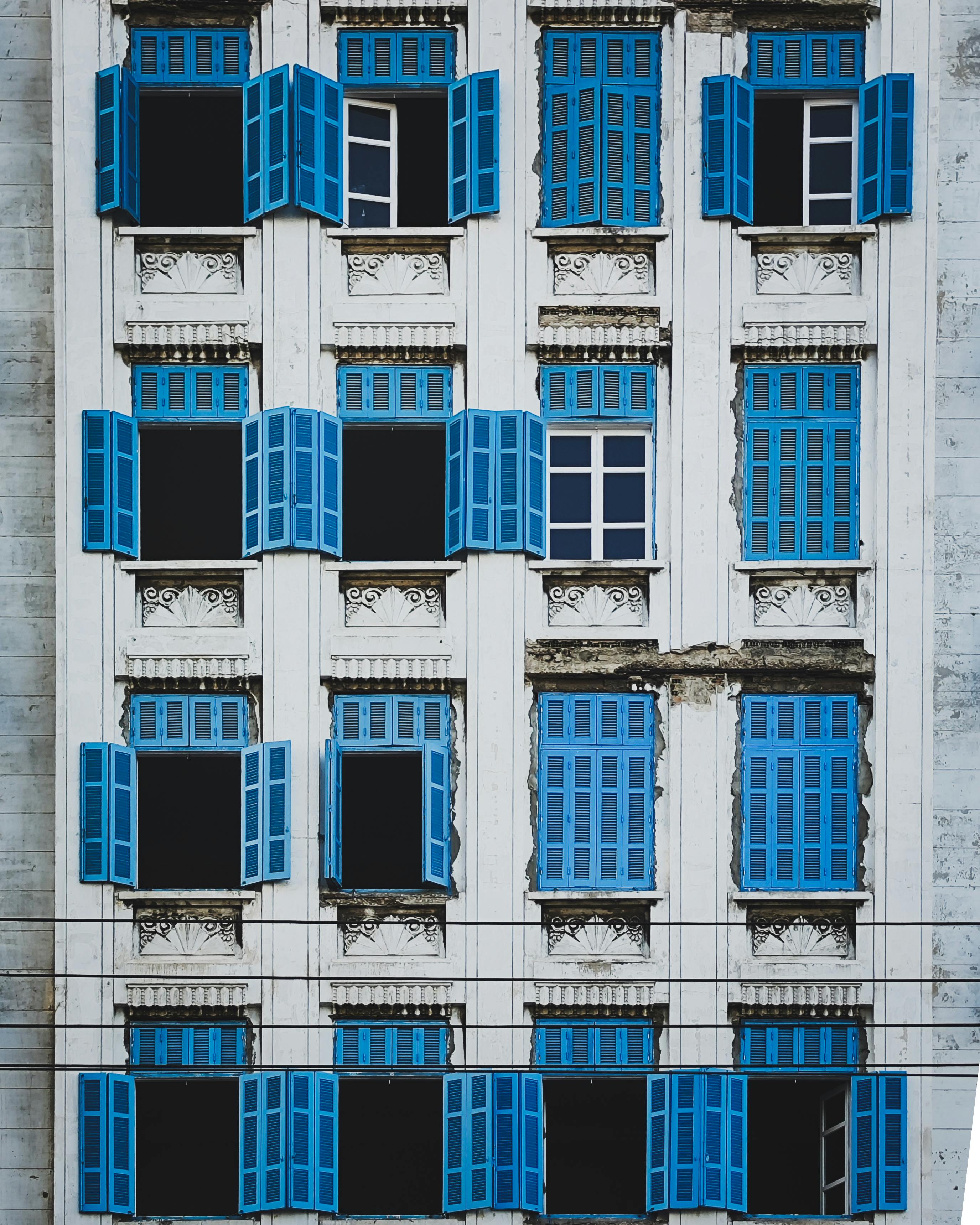 Building with Blue Window Shutters · Free Stock Photo