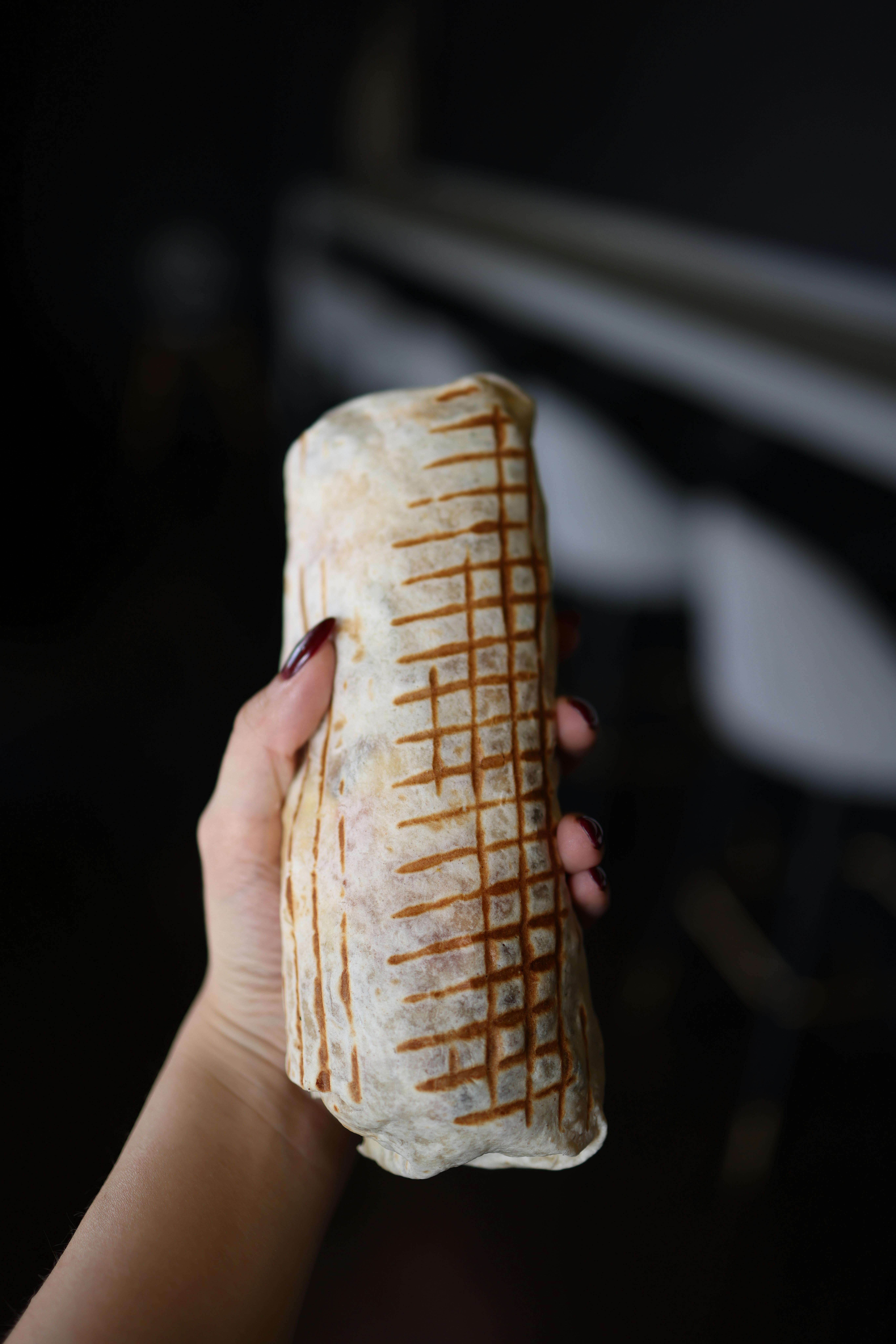 Hand Holding Burrito · Free Stock Photo