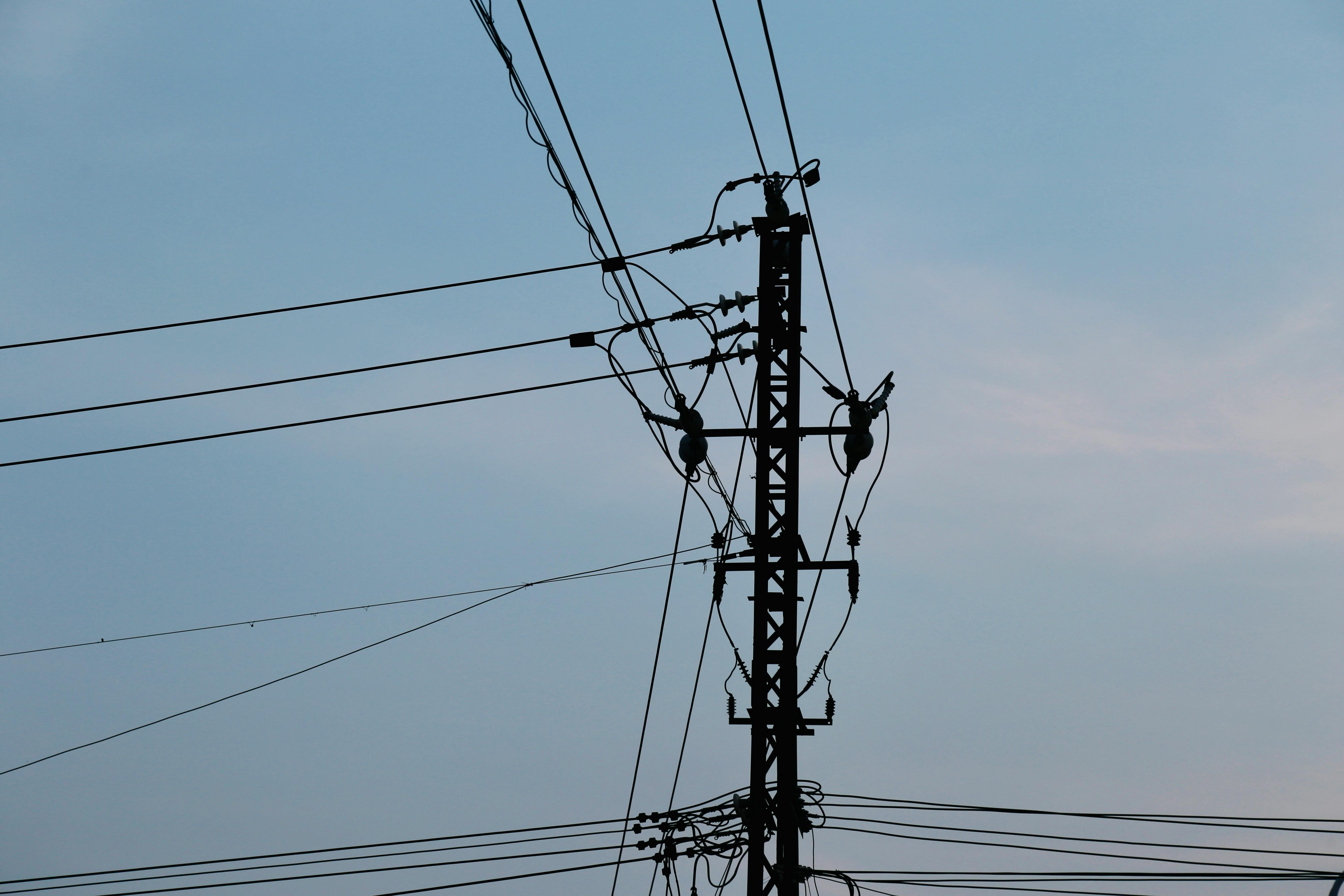 View of an Electricity Pole and Lines on the Background of a Blue Sky ...