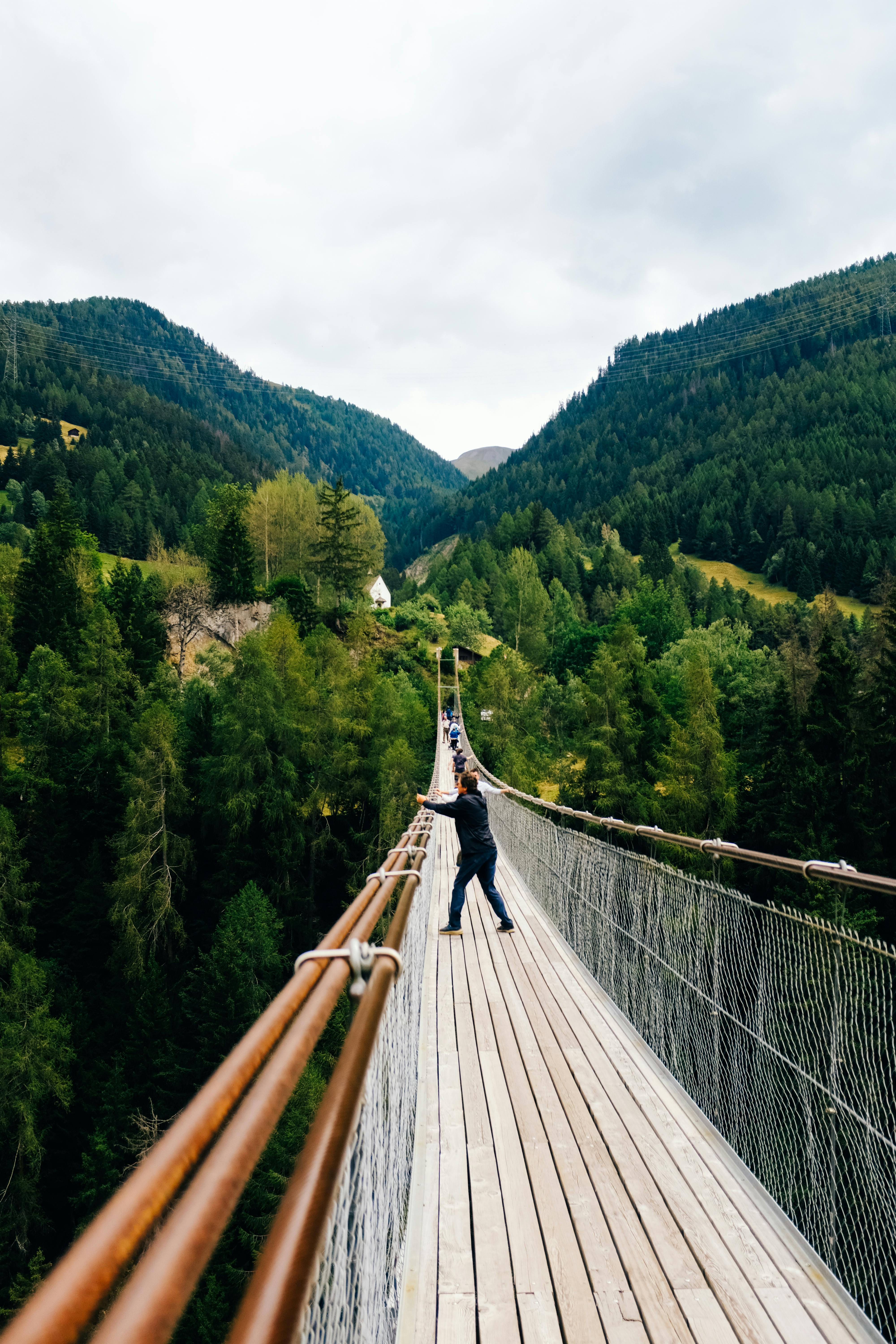 People Walking on a Bridge over a Valley · Free Stock Photo