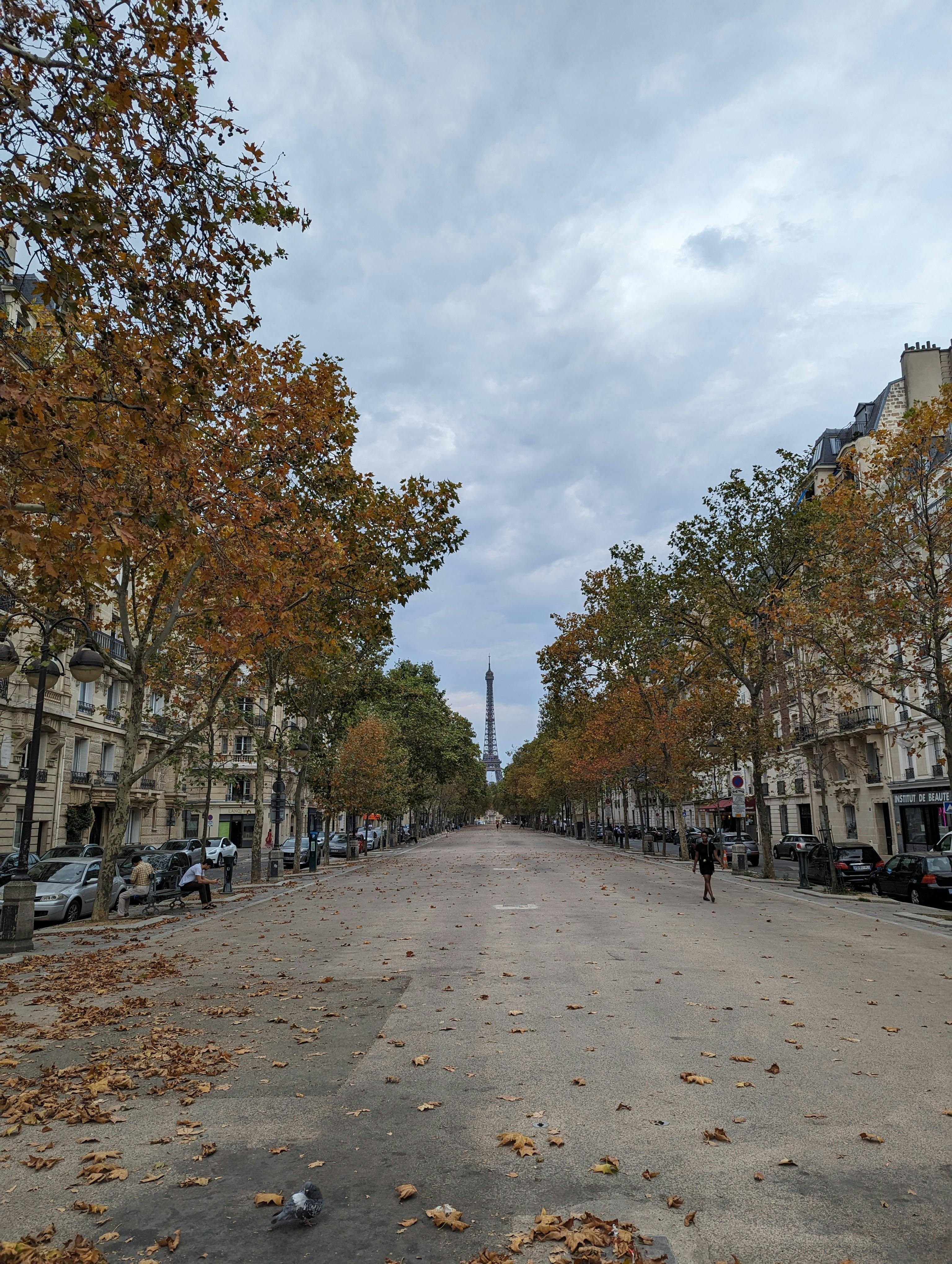 Eiffel Tower behind Empty Street in Paris · Free Stock Photo