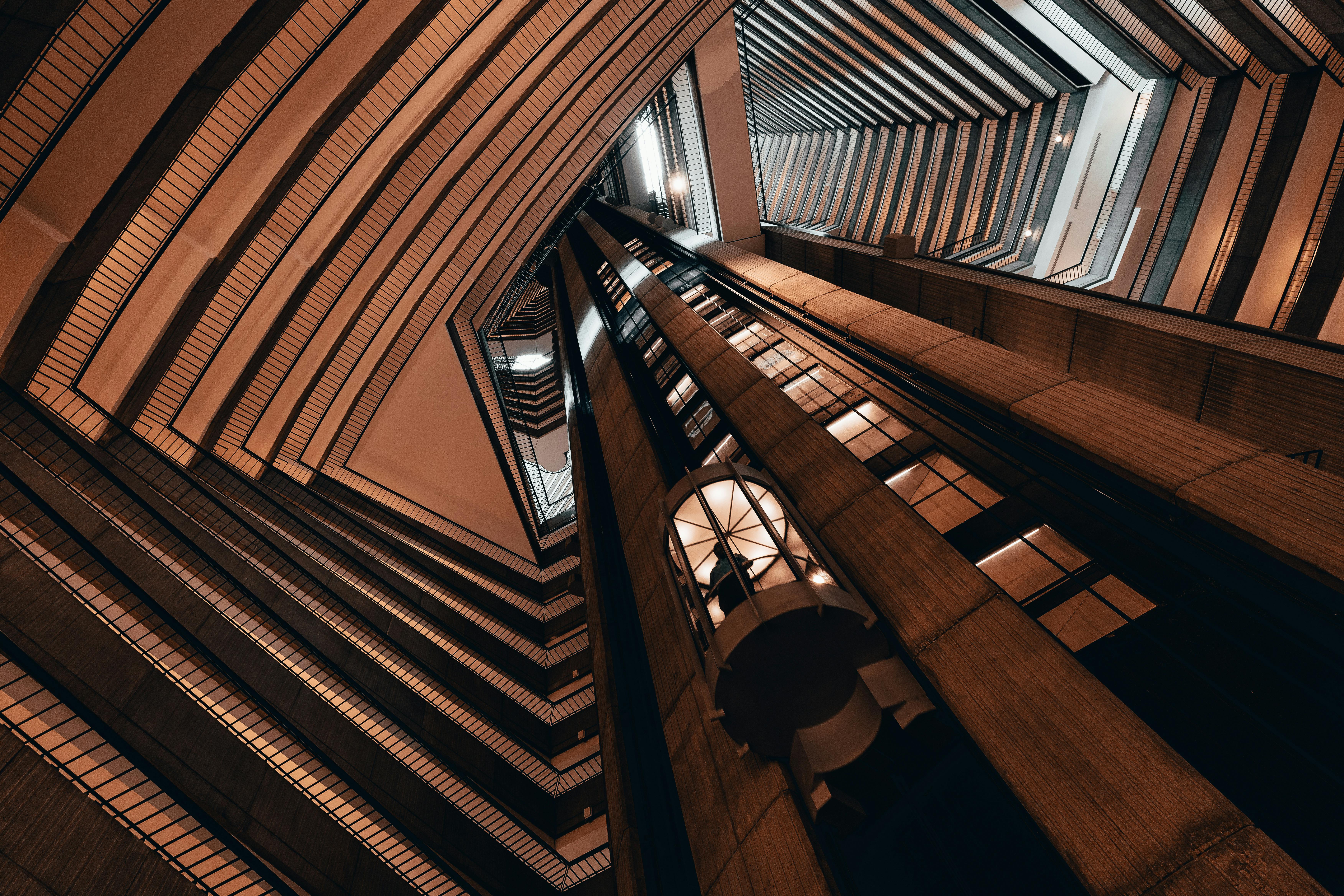 Modern atrium interior with skylight and palm trees · Free Stock Photo