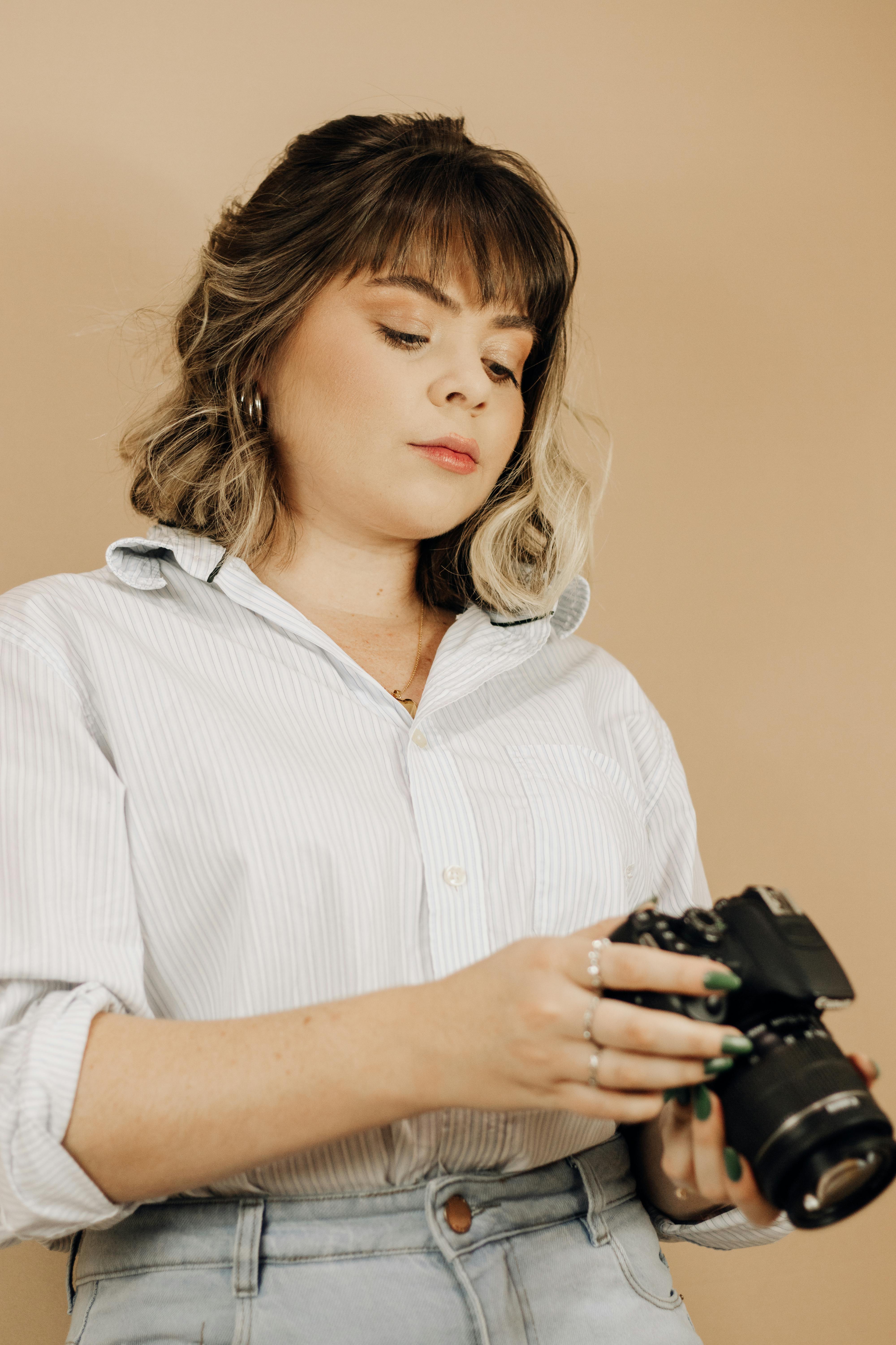 Woman Look into Camera Viewfinder · Free Stock Photo