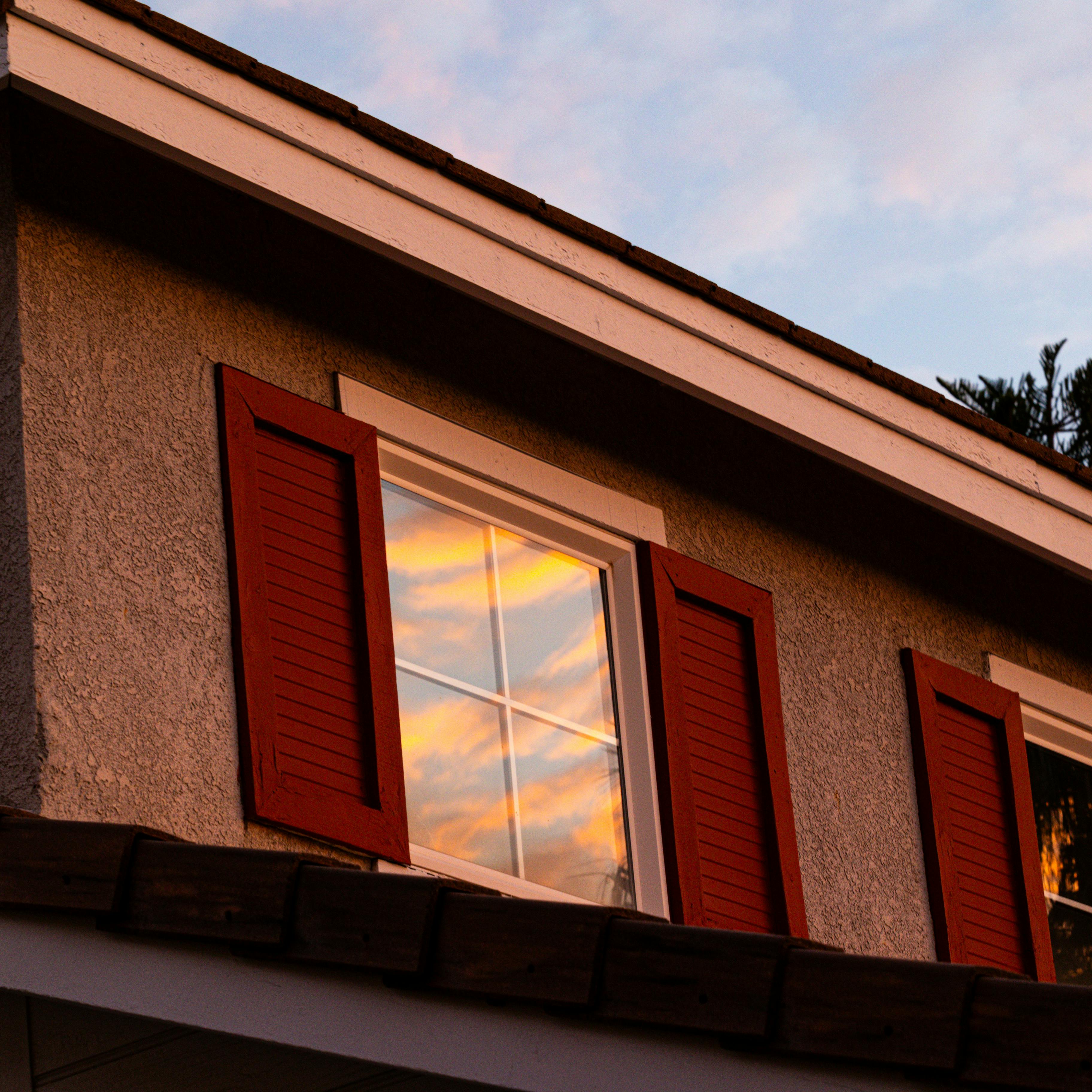 Sky at Sunset Mirroring in Window · Free Stock Photo