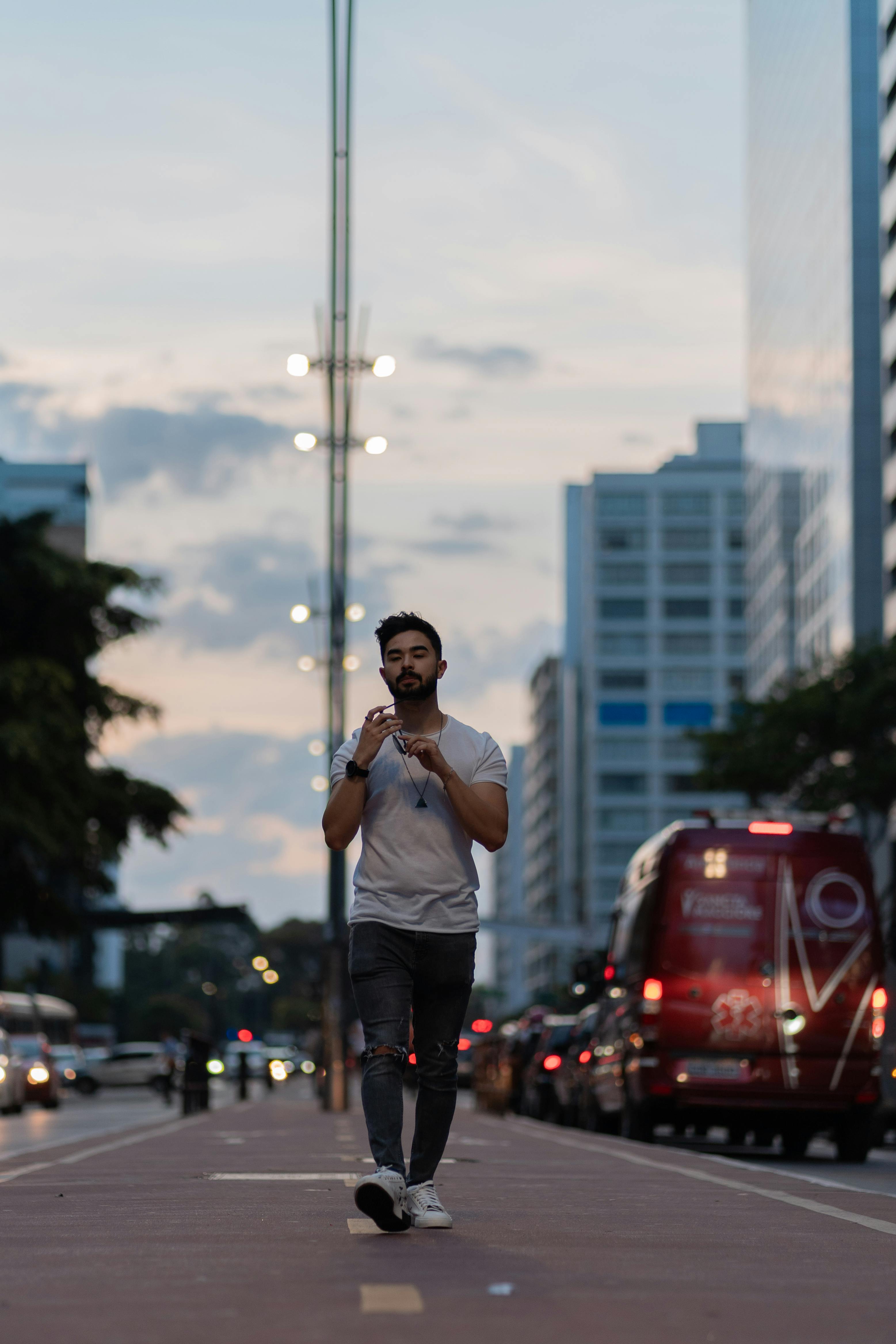 Man in White T-shirt Walking Street · Free Stock Photo