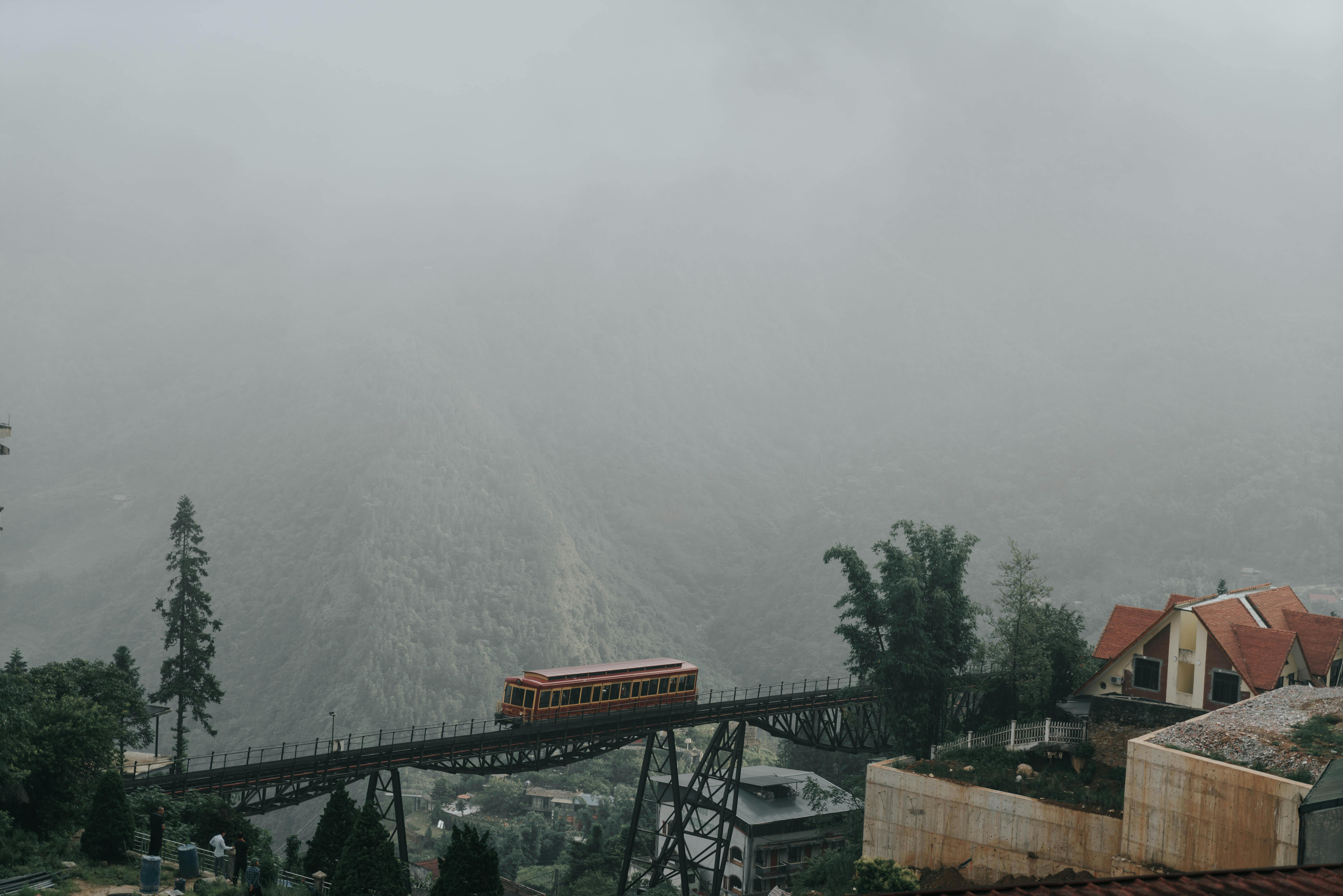 Train on Railway Bridge in Town · Free Stock Photo