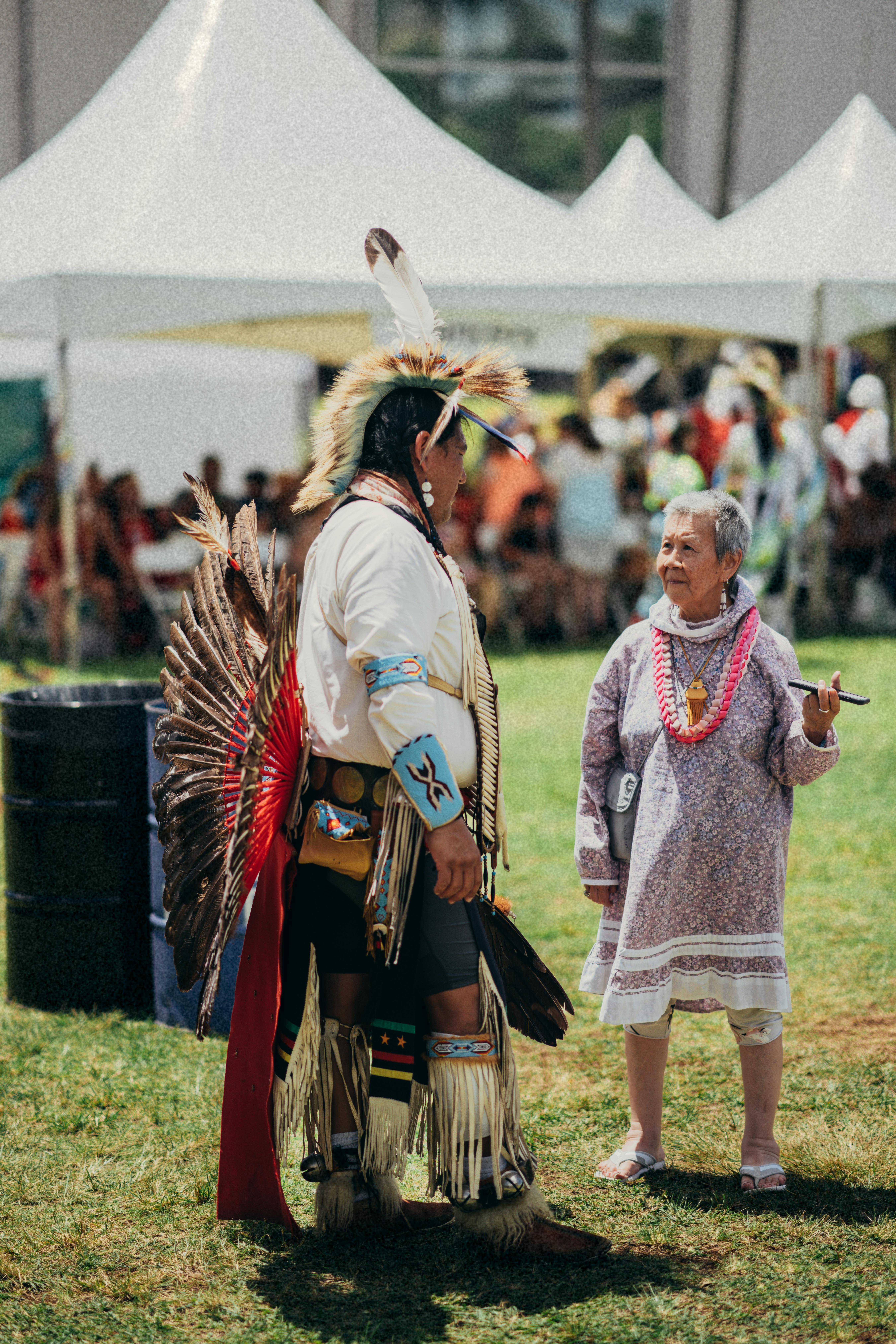Man in Traditional Plume Smoking Pipe · Free Stock Photo