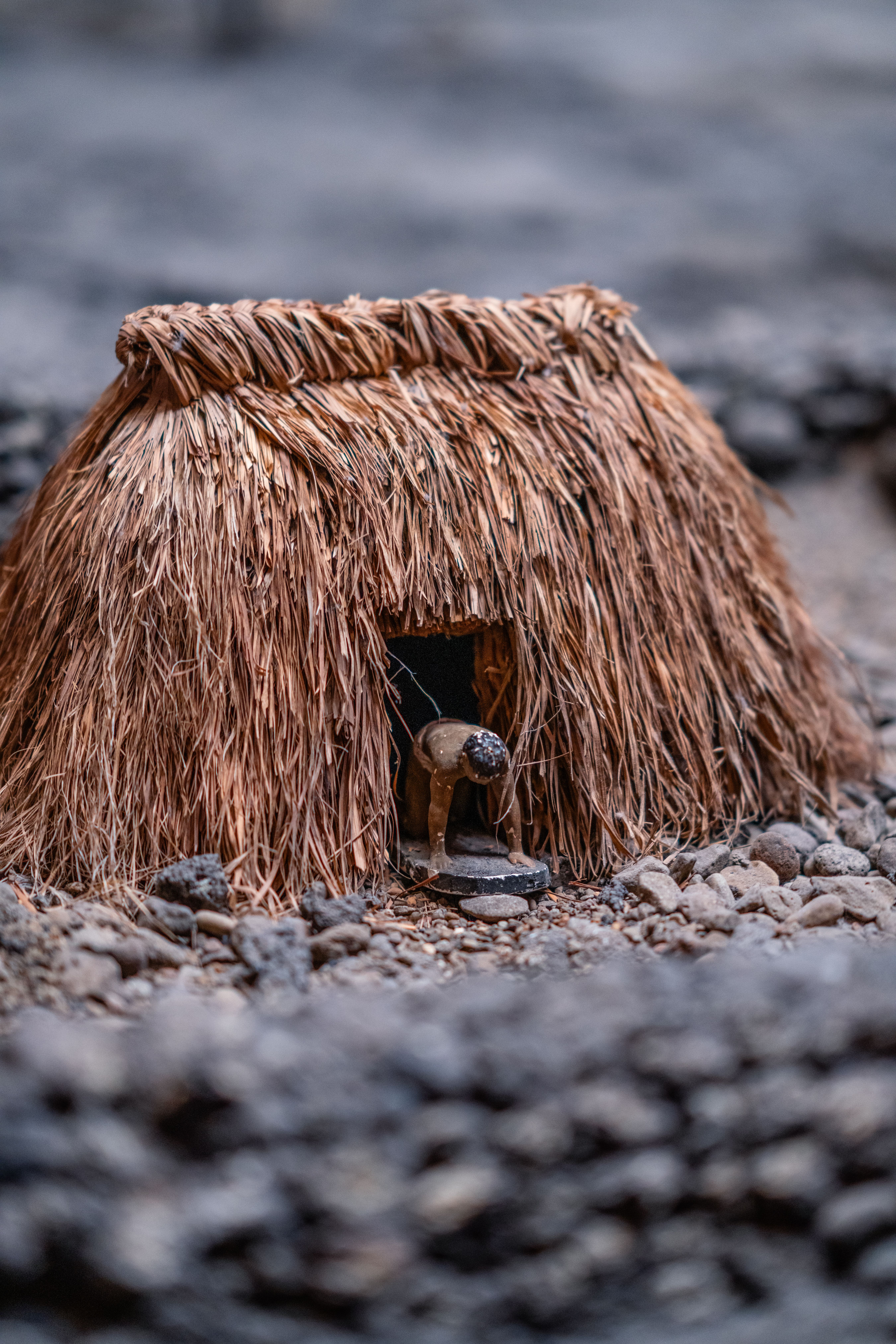 Figurine of a Person Kneeling in the Entrance of a Straw House · Free ...