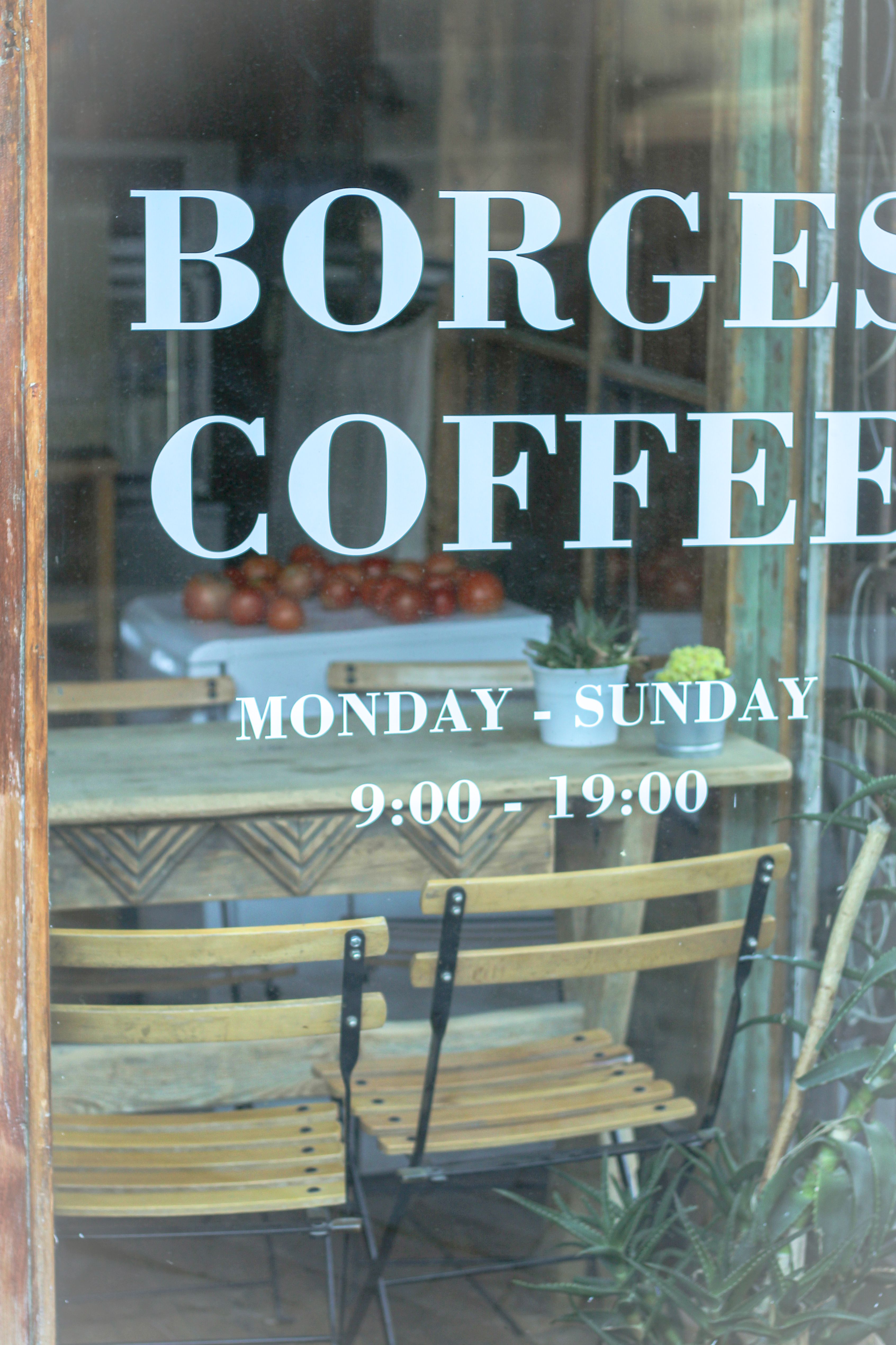 Signboard on a Window in a Coffee Shop · Free Stock Photo