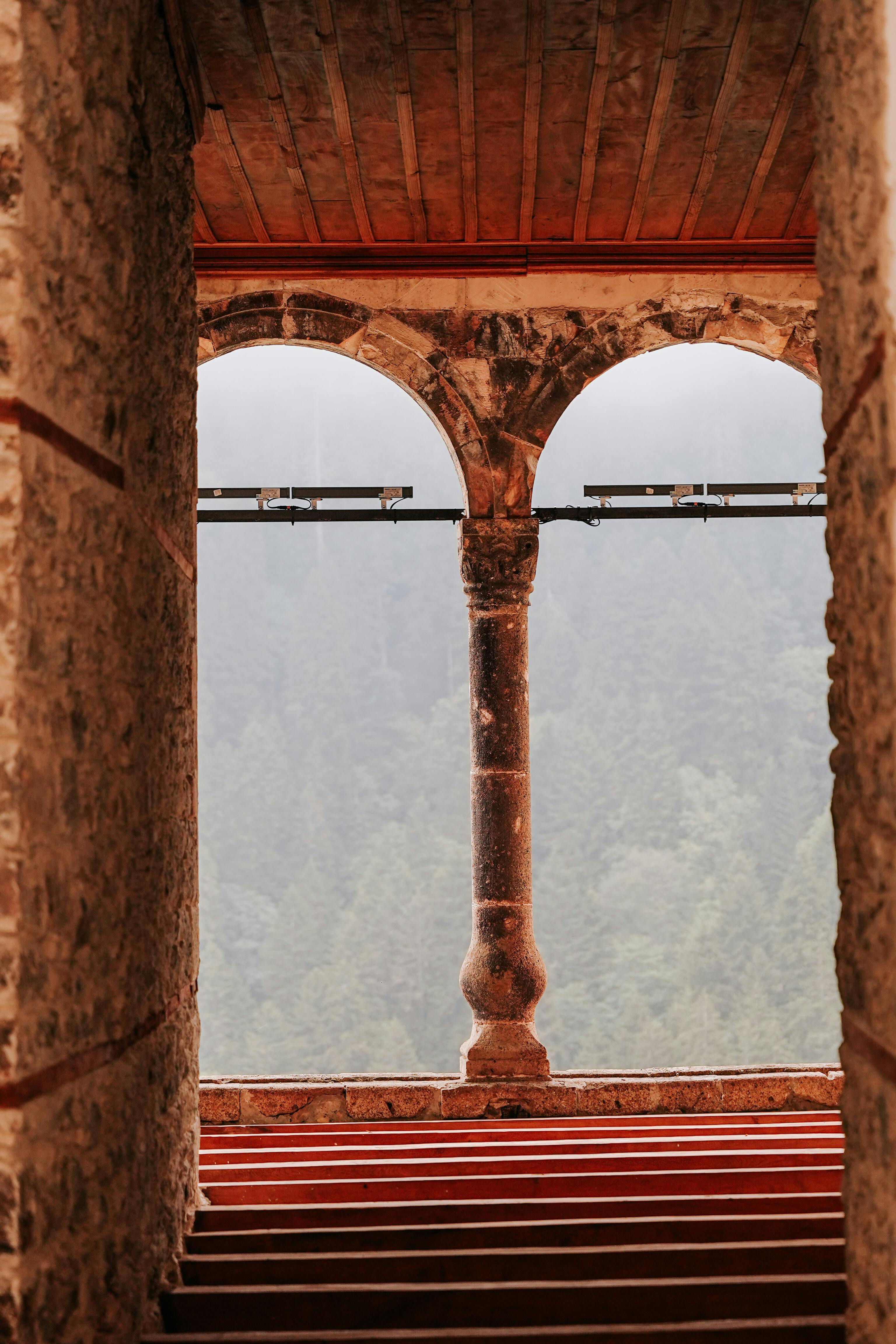 Arches between Columns Overlooking Mountainside · Free Stock Photo