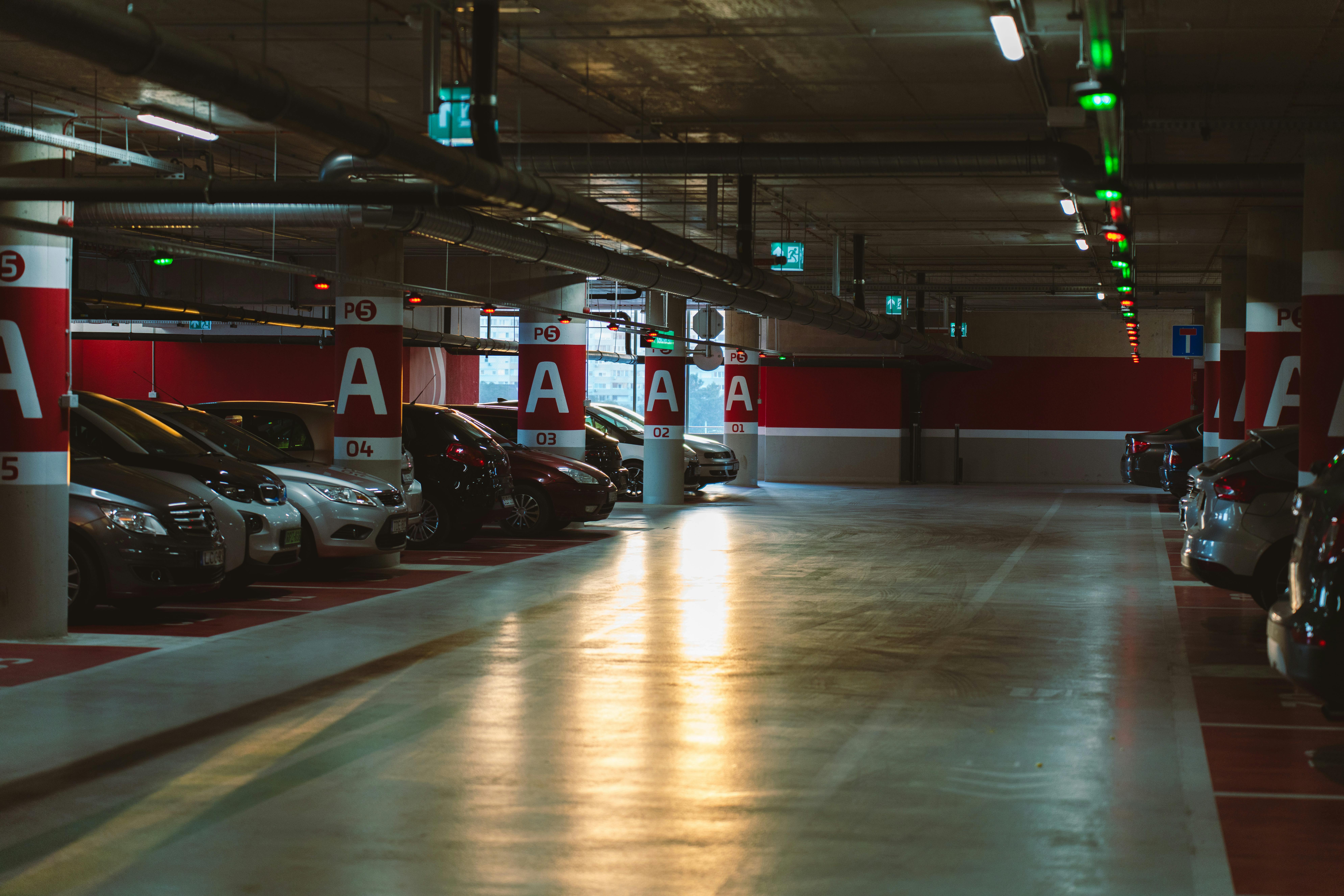 Cars Parked on Red Level of Parking · Free Stock Photo
