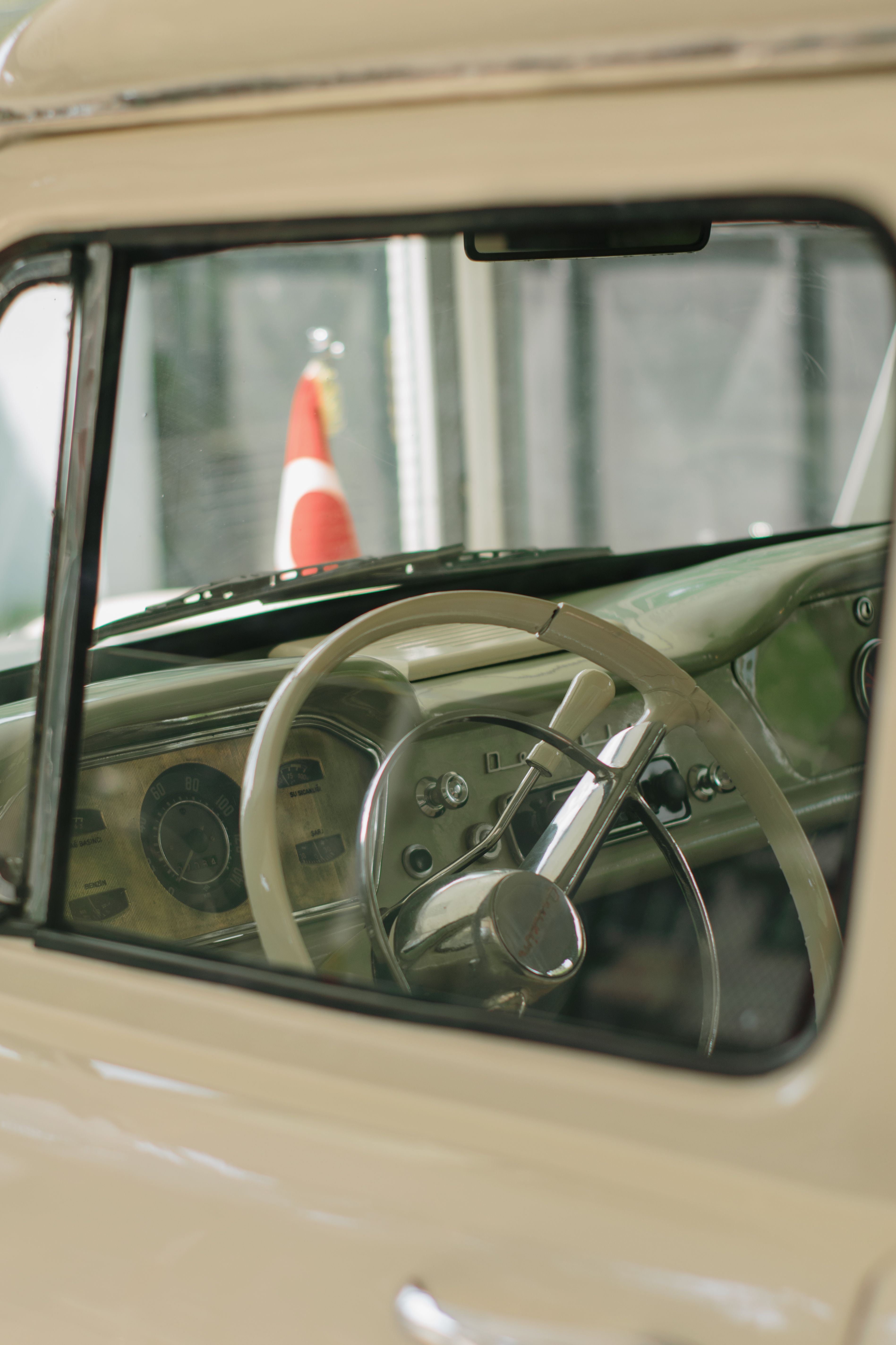 Window and Steering Wheel in Vintage Car · Free Stock Photo