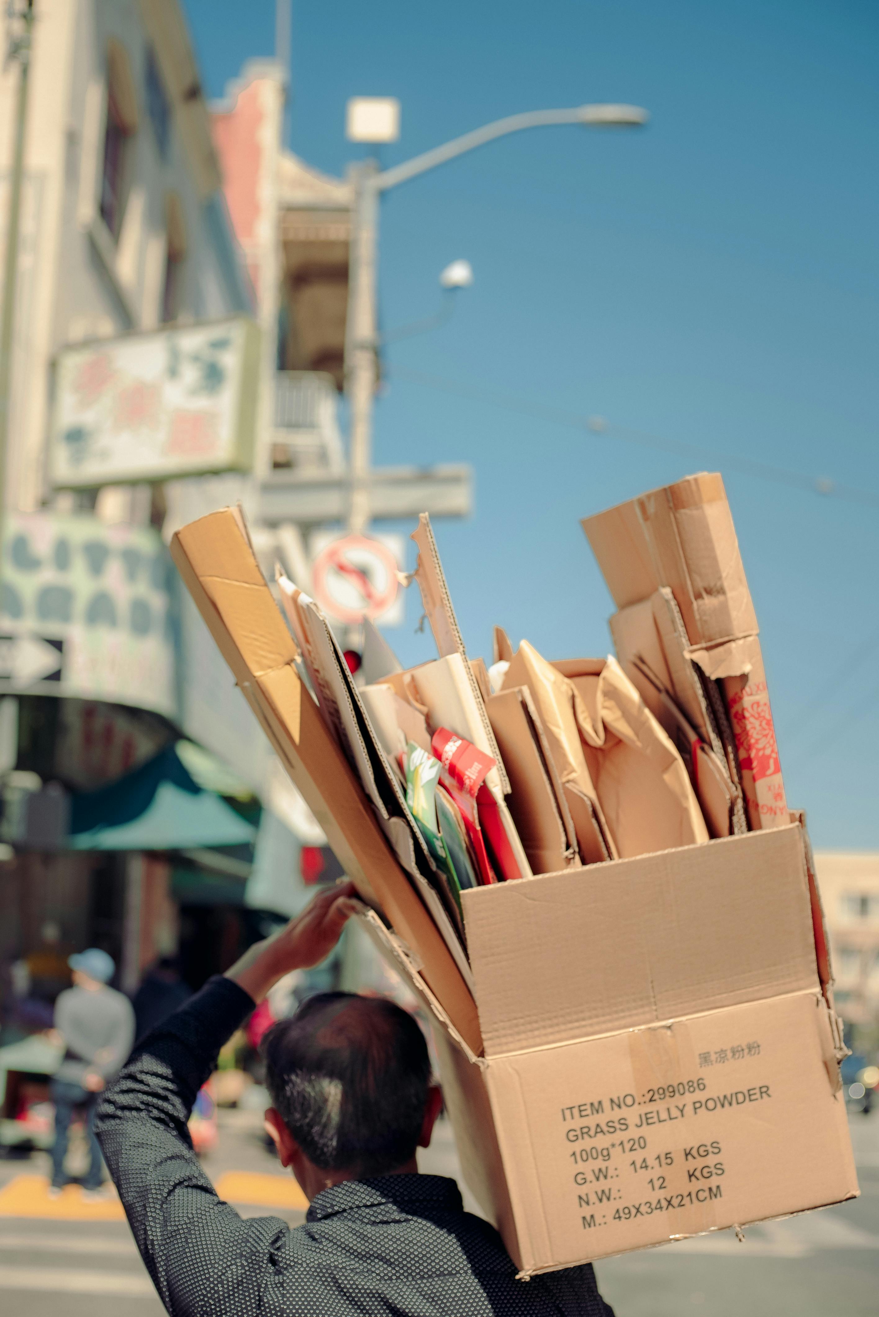 Man Carrying Cartoon Box · Free Stock Photo