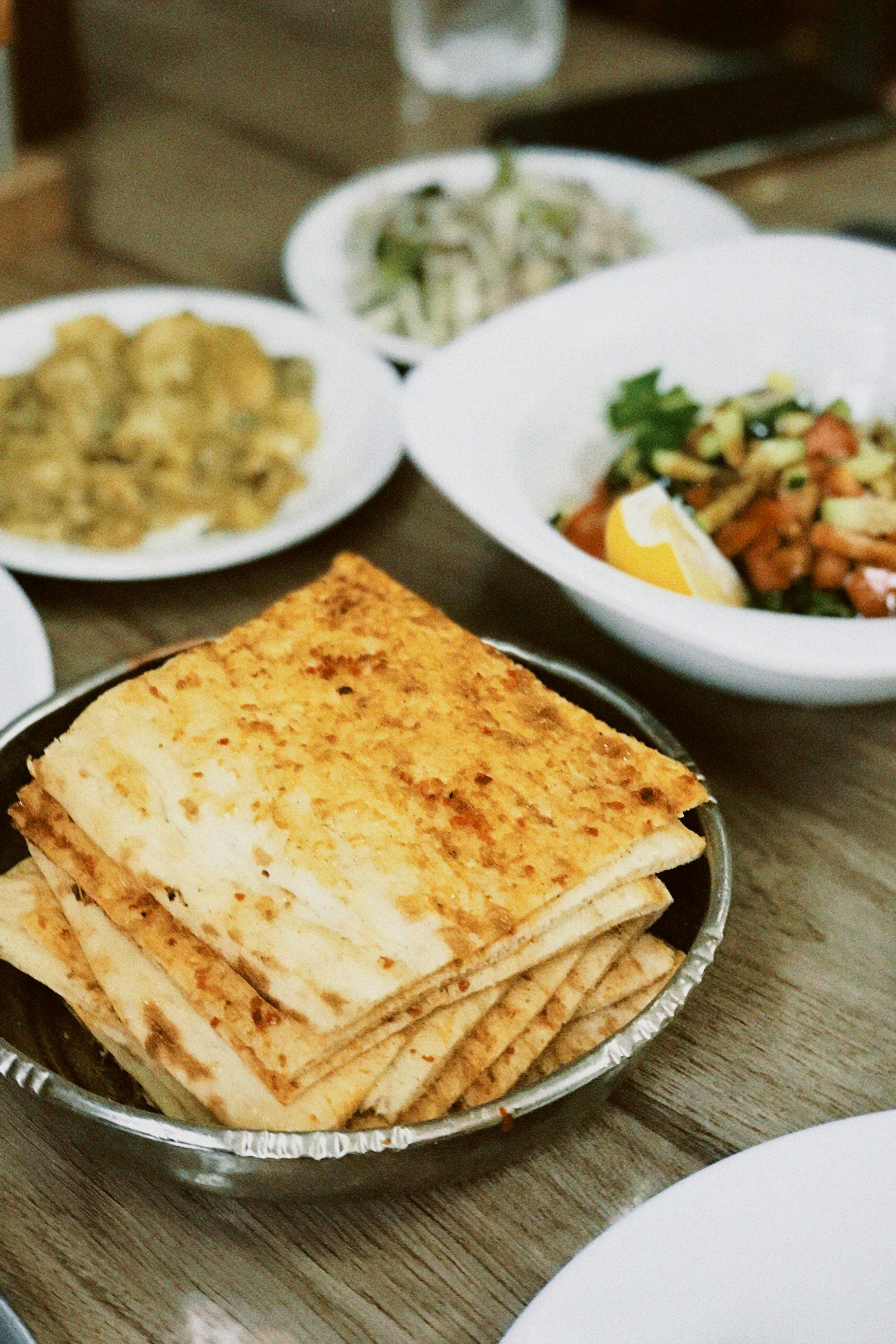 Flatbread and Other Foods on the Table · Free Stock Photo