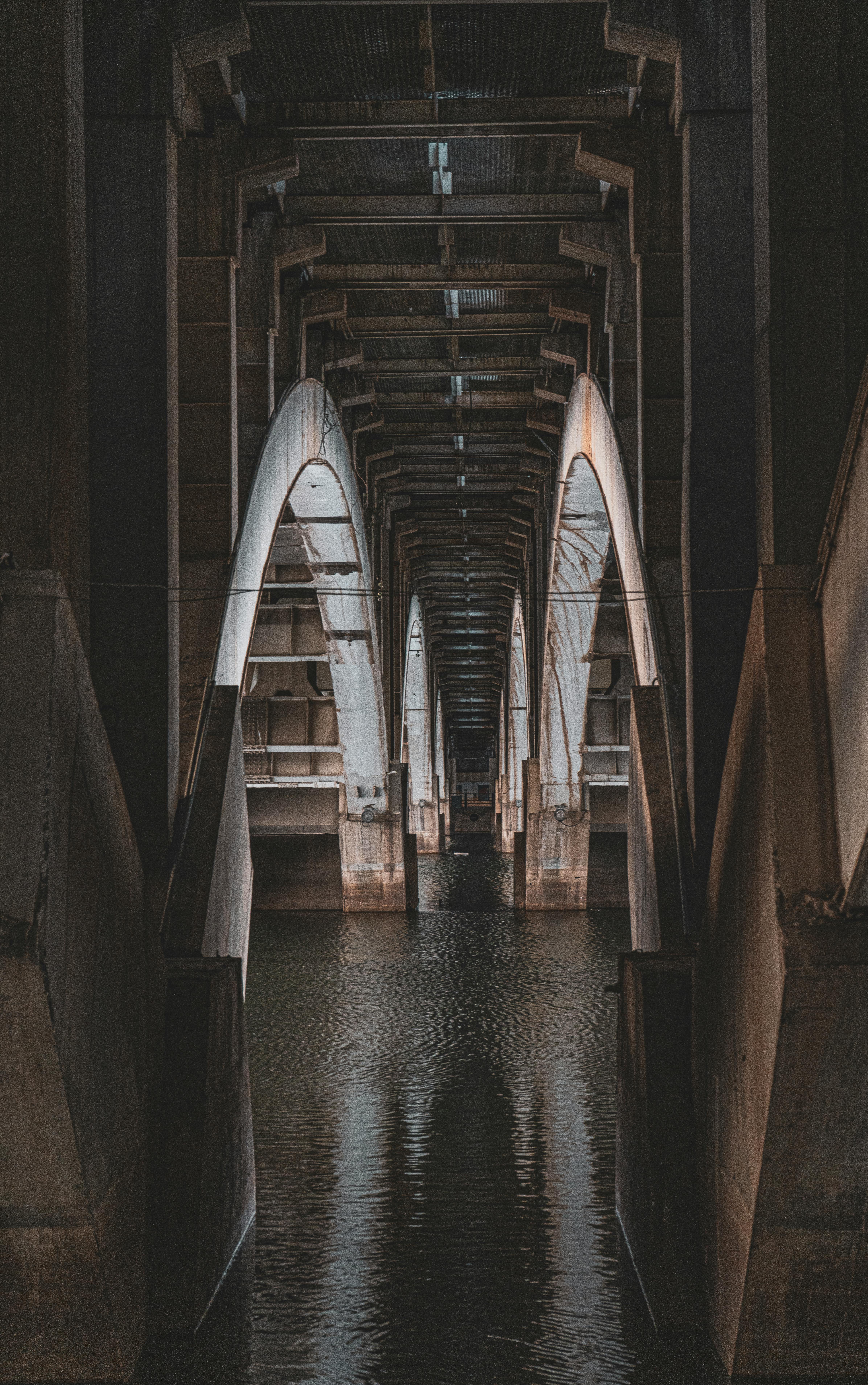 Symmetrical View under an Arch Bridge · Free Stock Photo