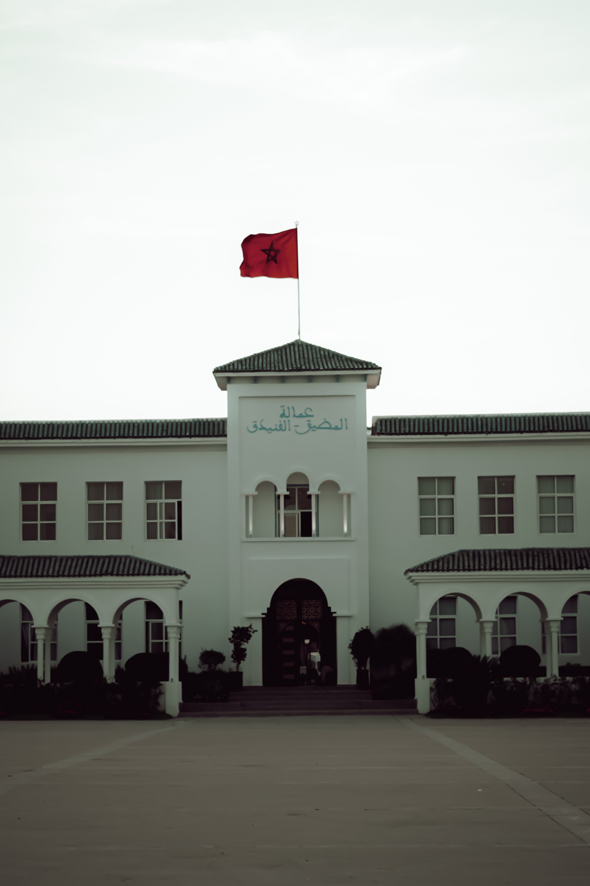 White Building with the Moroccan Flag · Free Stock Photo