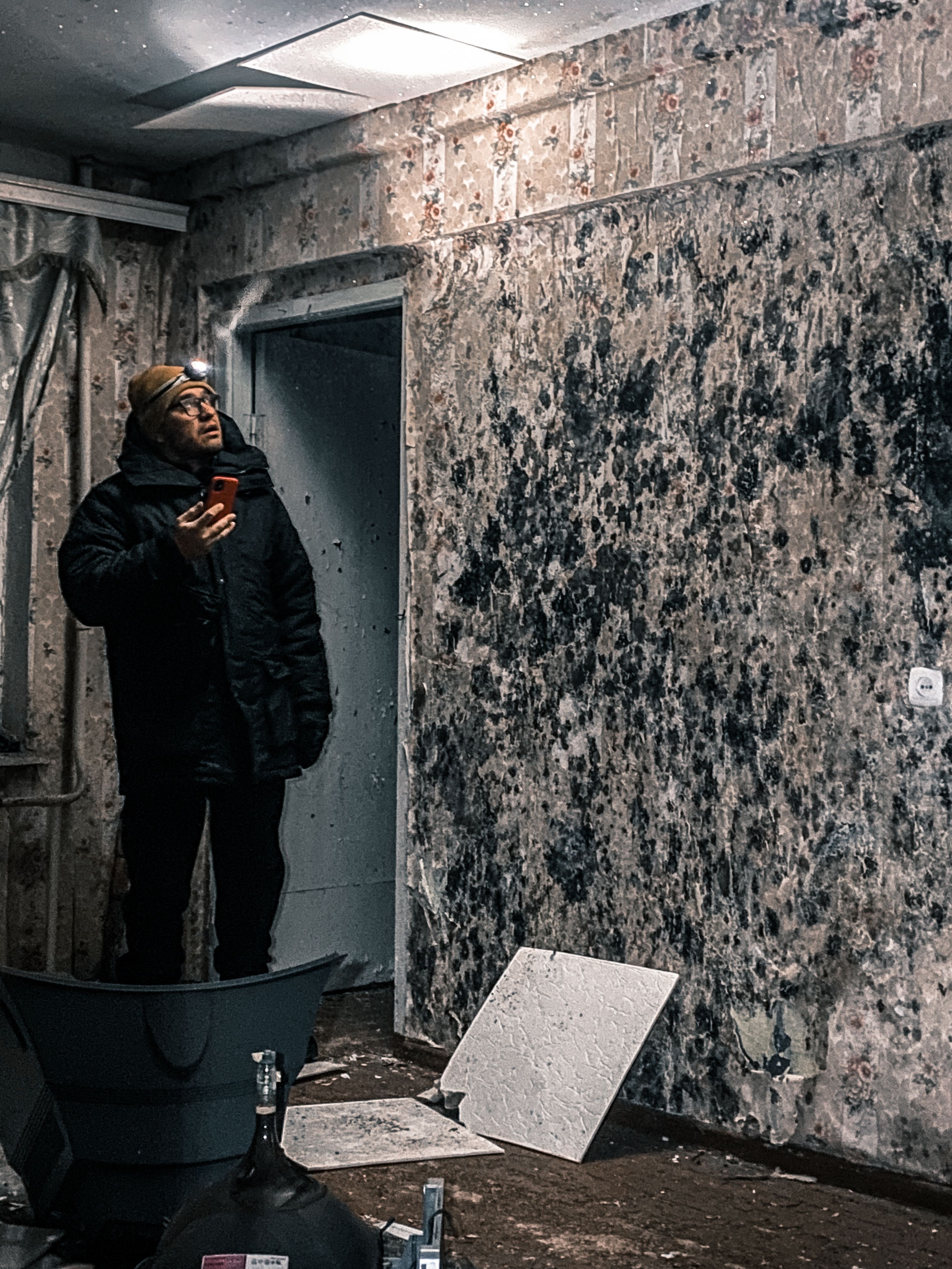 Man in Jacket Standing in Abandoned Room · Free Stock Photo