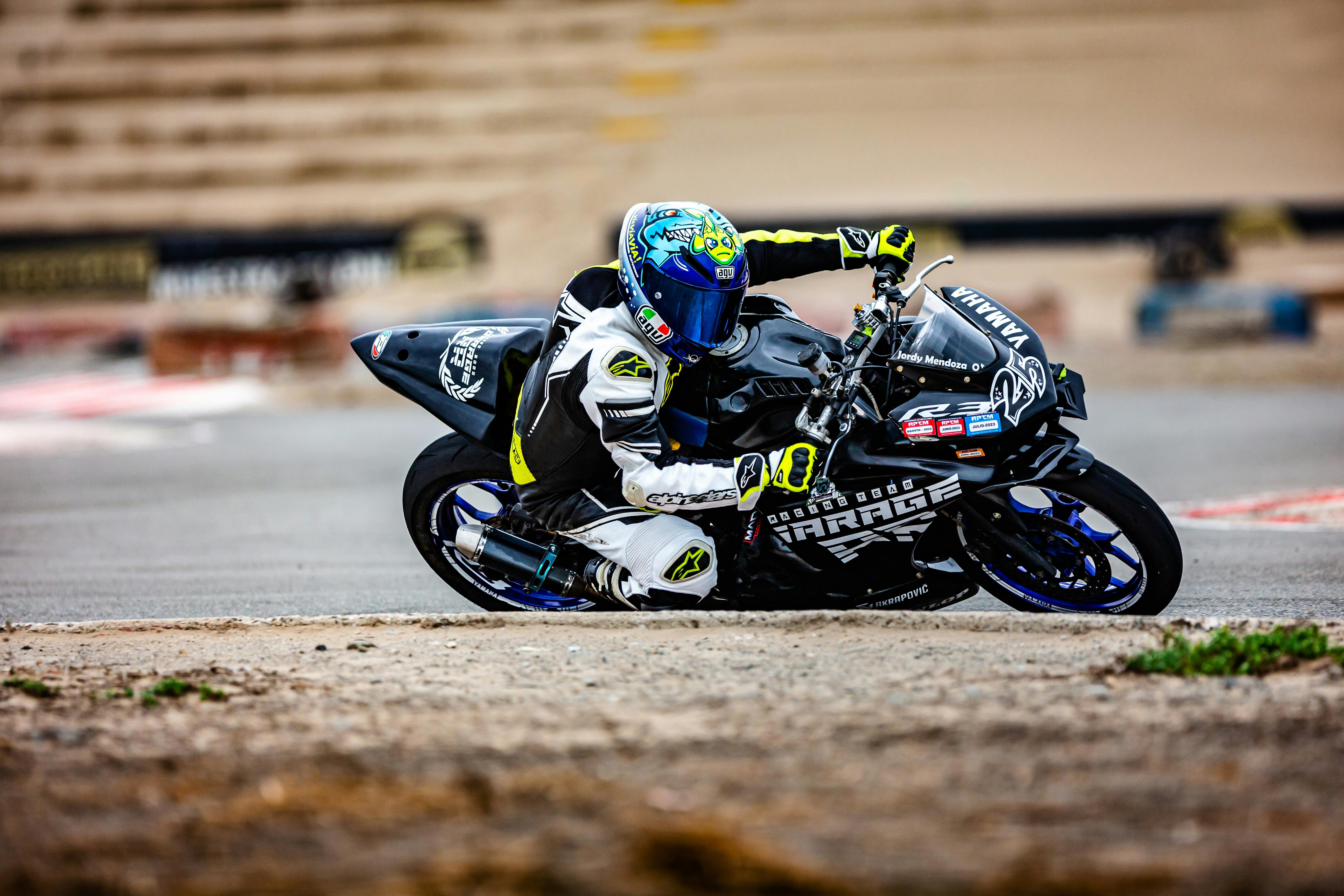 Motorcycle Racer in Tight Turn on the Race Track · Free Stock Photo