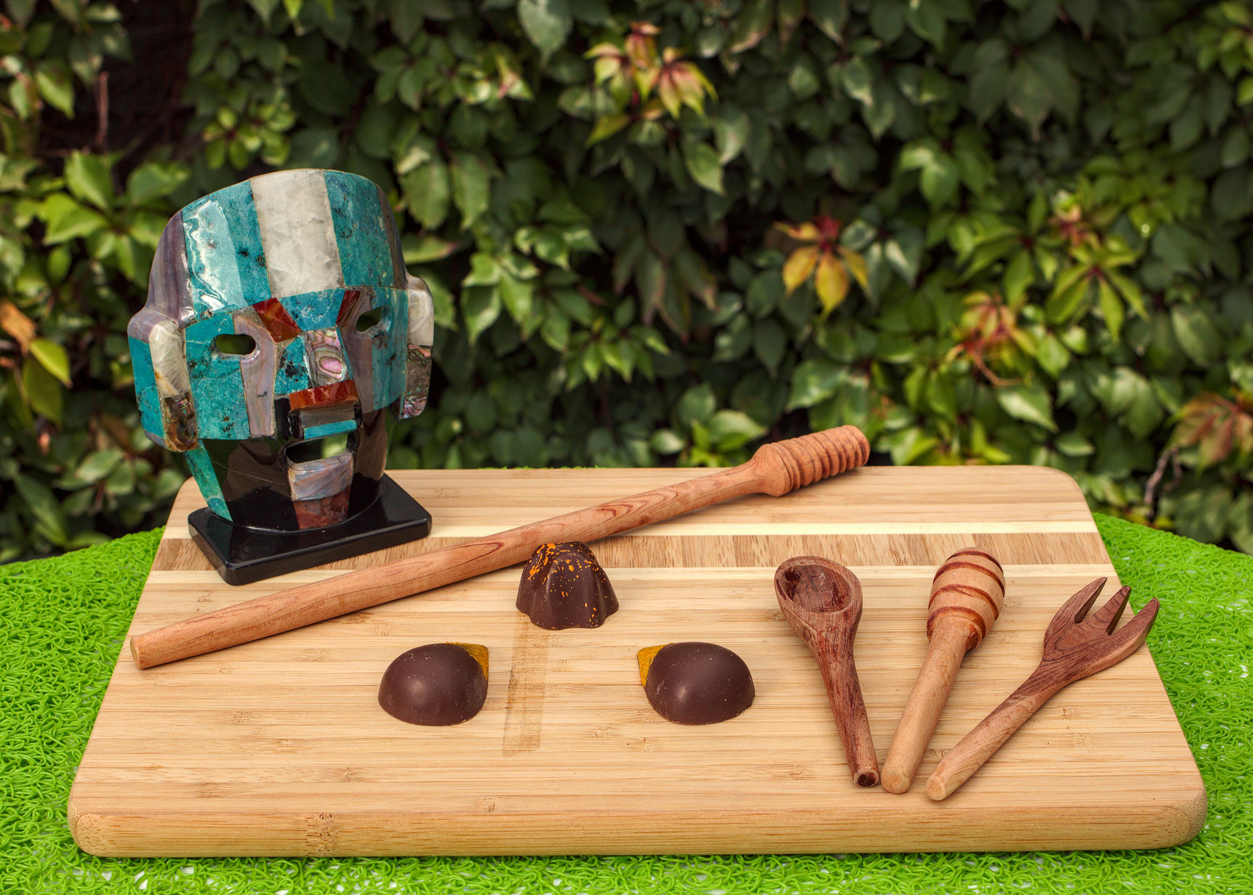 Wooden Kitchen Tools and Chocolate Pralines on a Board · Free Stock Photo