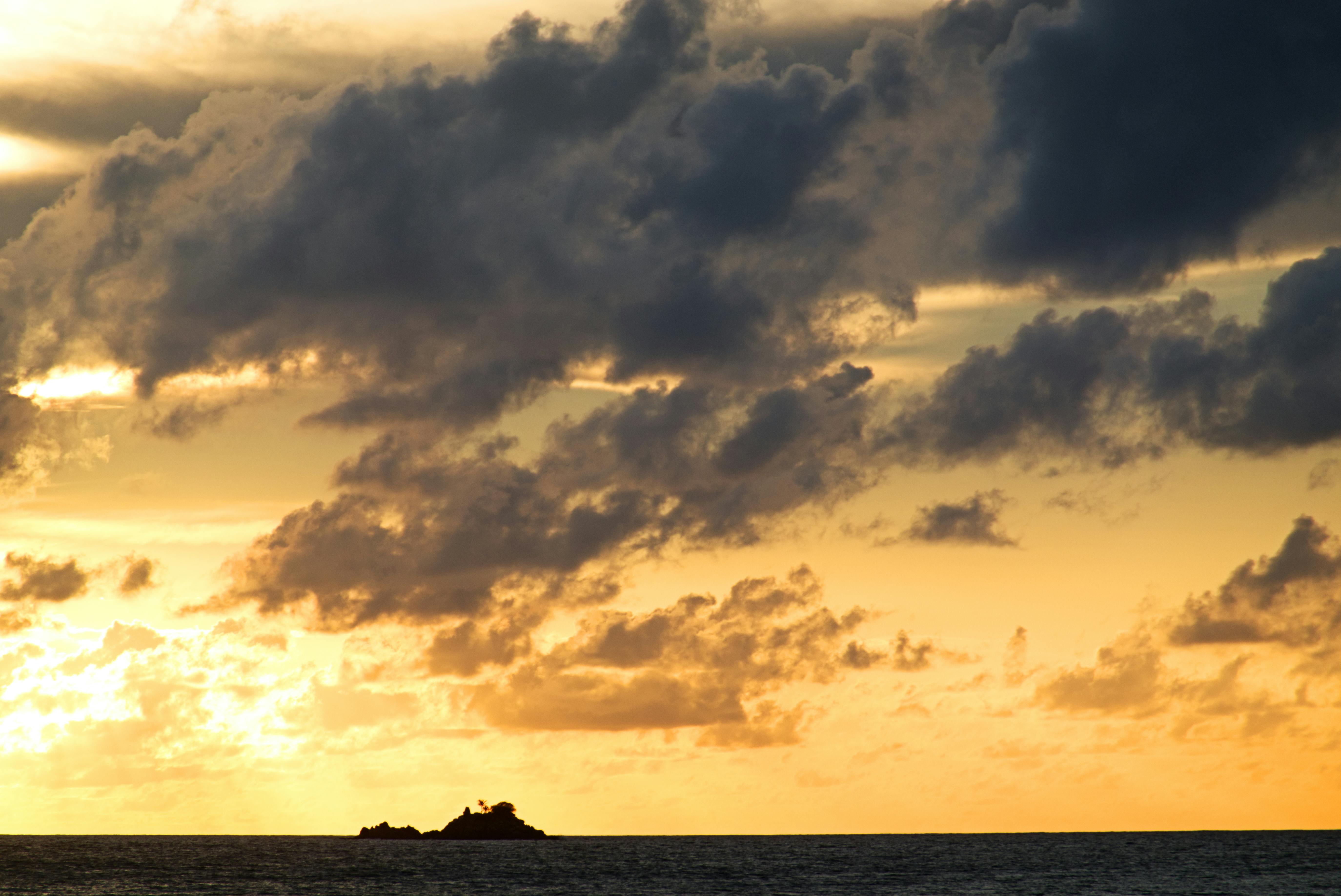 Clouds on Yellow Sky over Sea at Sunset · Free Stock Photo
