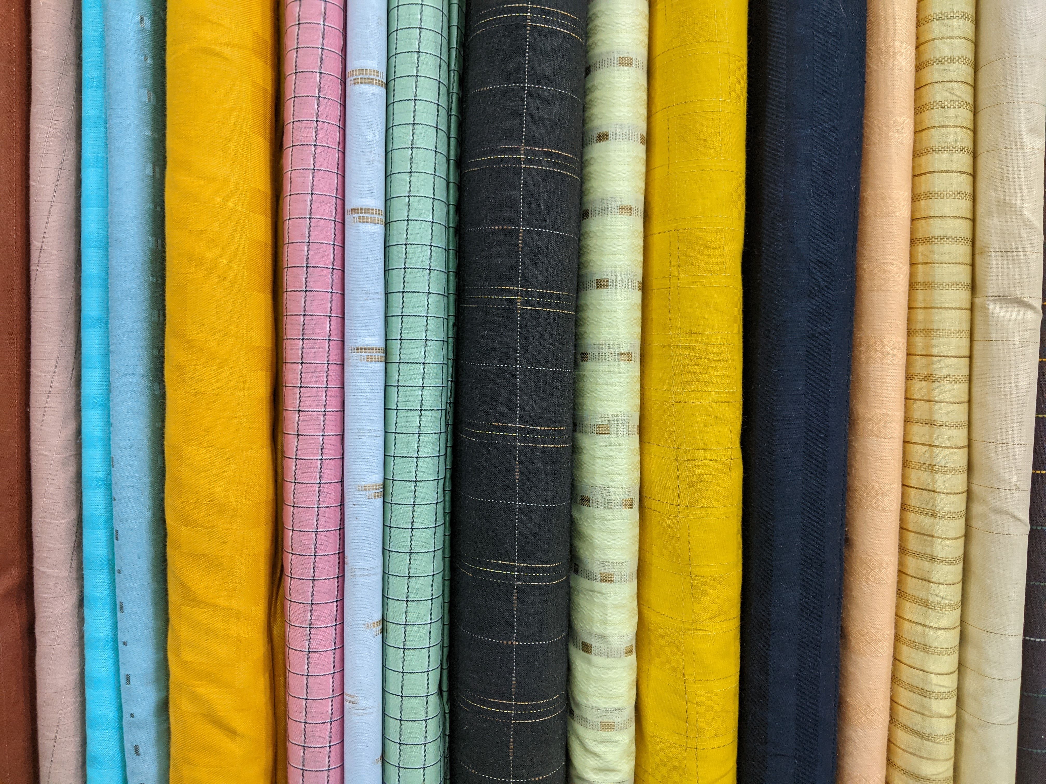 Rolls of Multi Colored Fabrics · Free Stock Photo