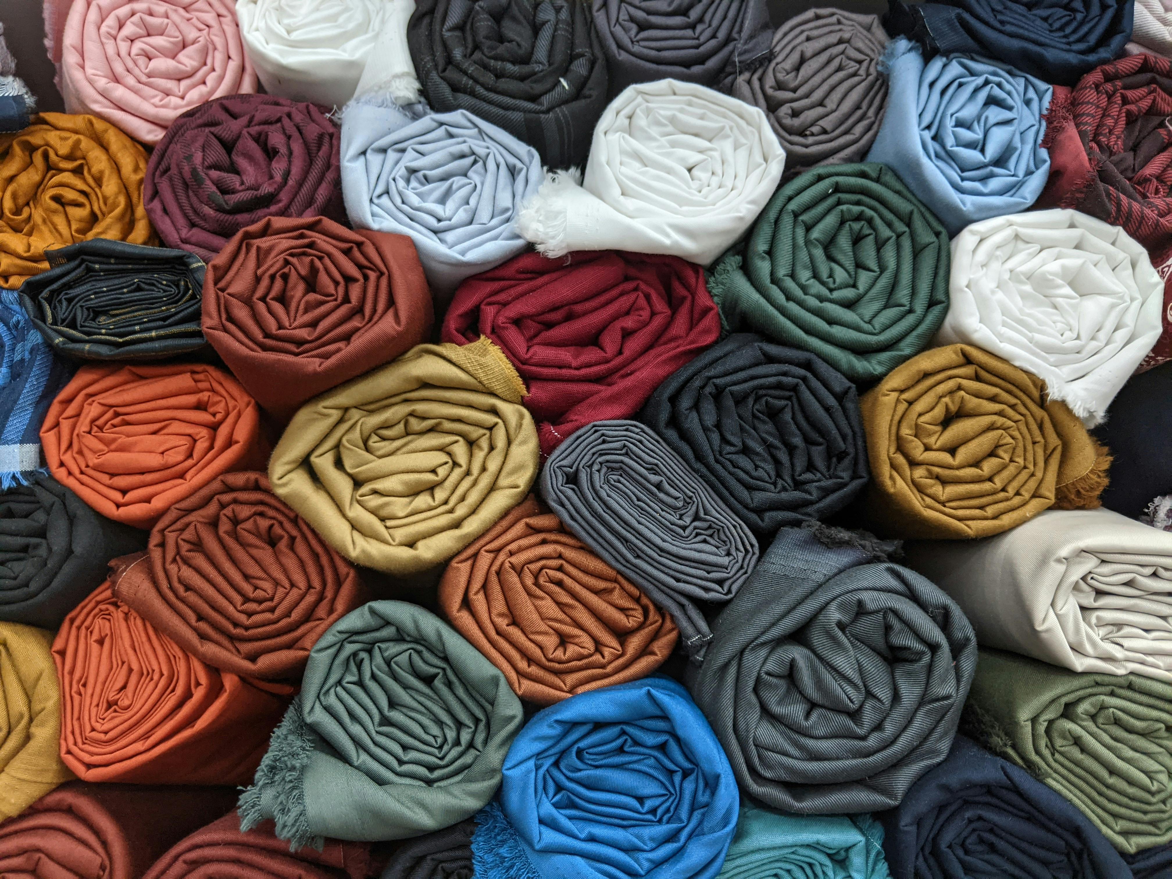 Rolls of Multi Colored Fabrics · Free Stock Photo